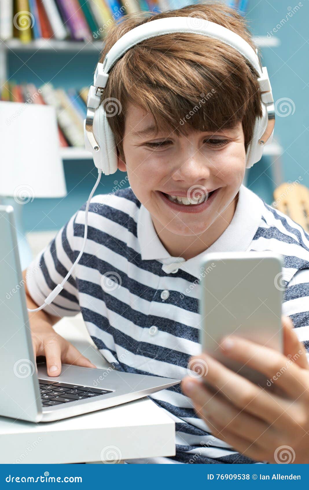 Teenage Boy Using Technology in Bedroom Stock Photo - Image of ...