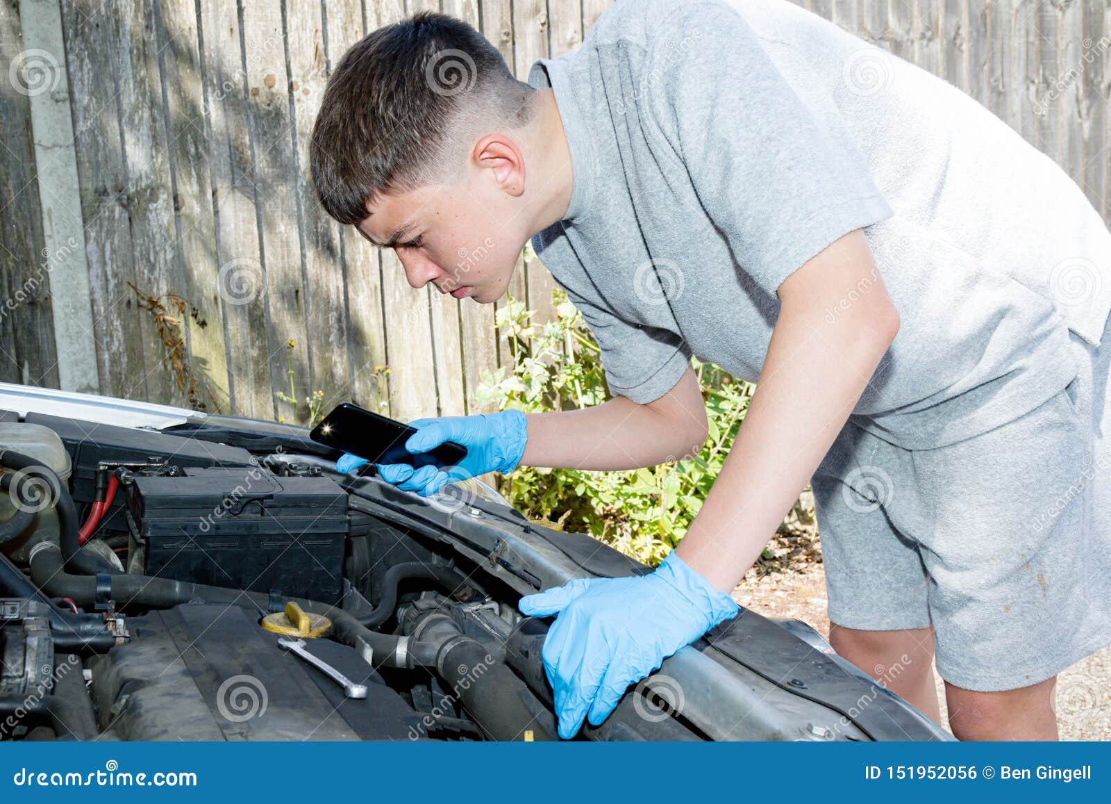 Teenage Boy Working on a Car Stock Photo - Image of mechanic ...
