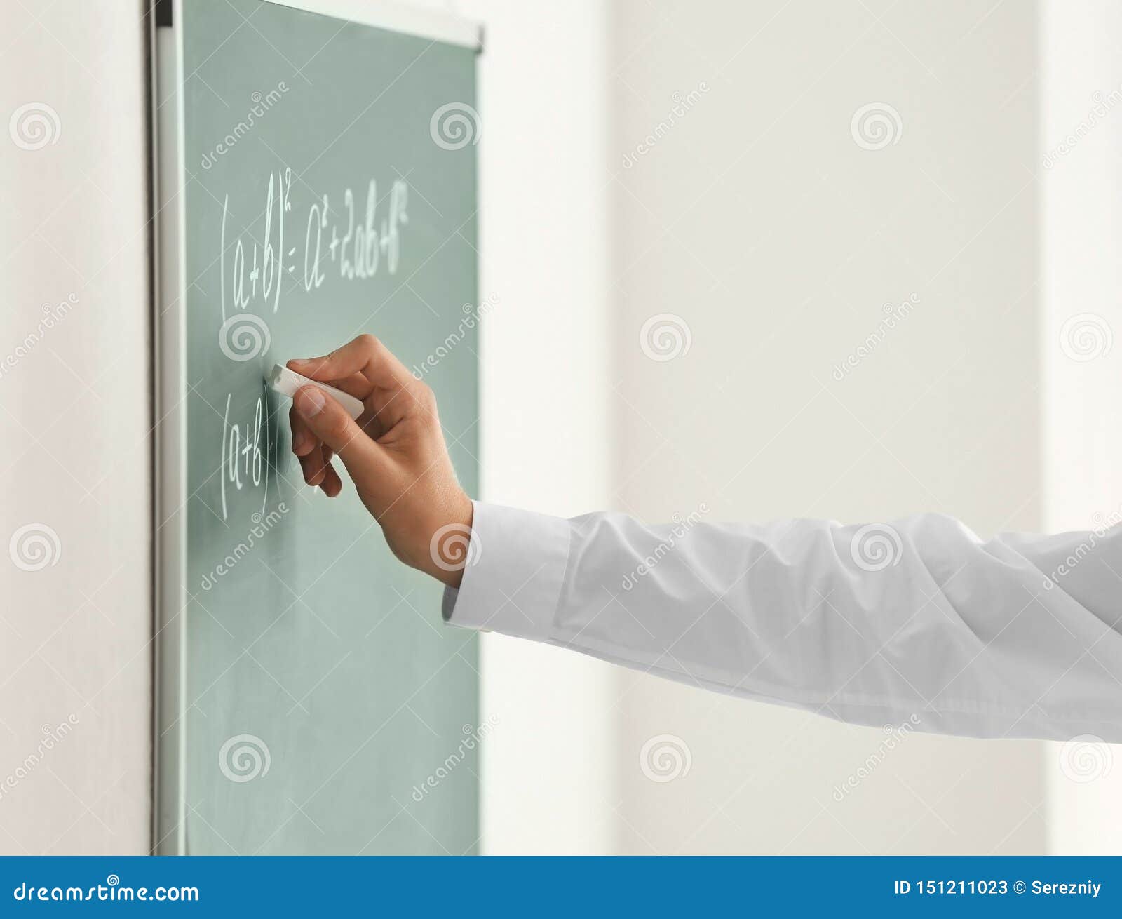 Teenage Boy Writing on Chalkboard in Classroom Stock Image - Image of ...