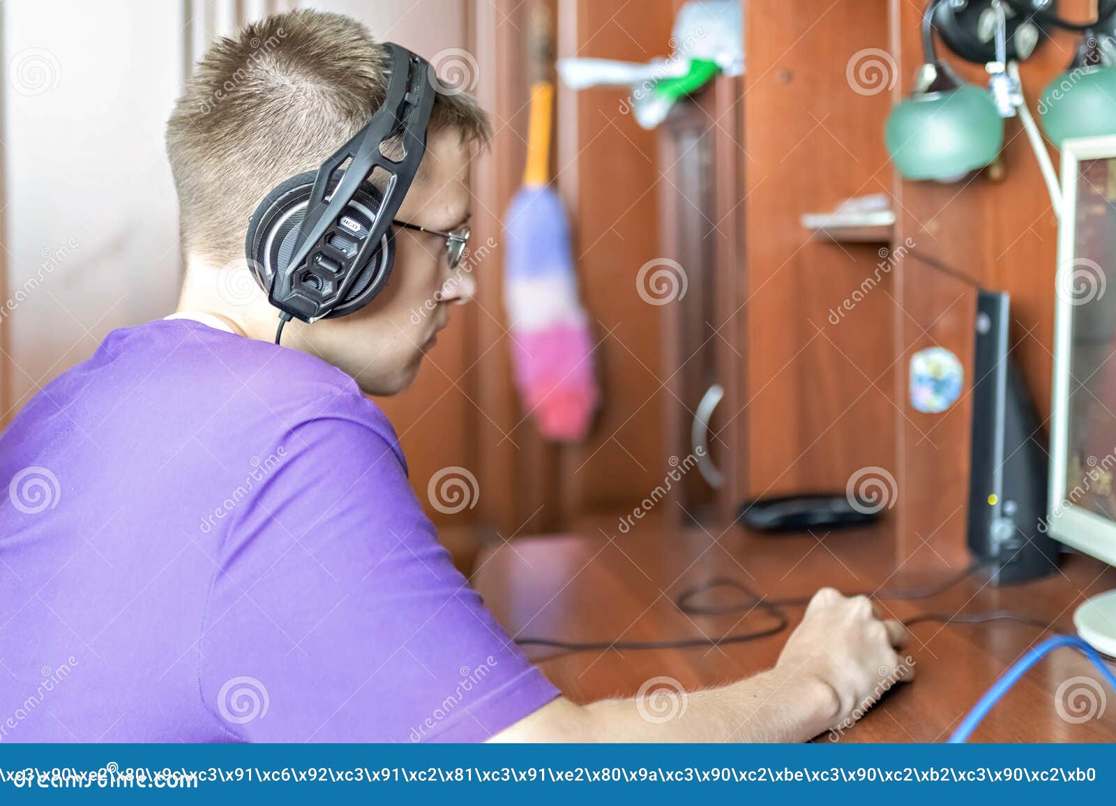 A Teenage Boy, a Young Man Playing Video Games on a Computer, Using ...