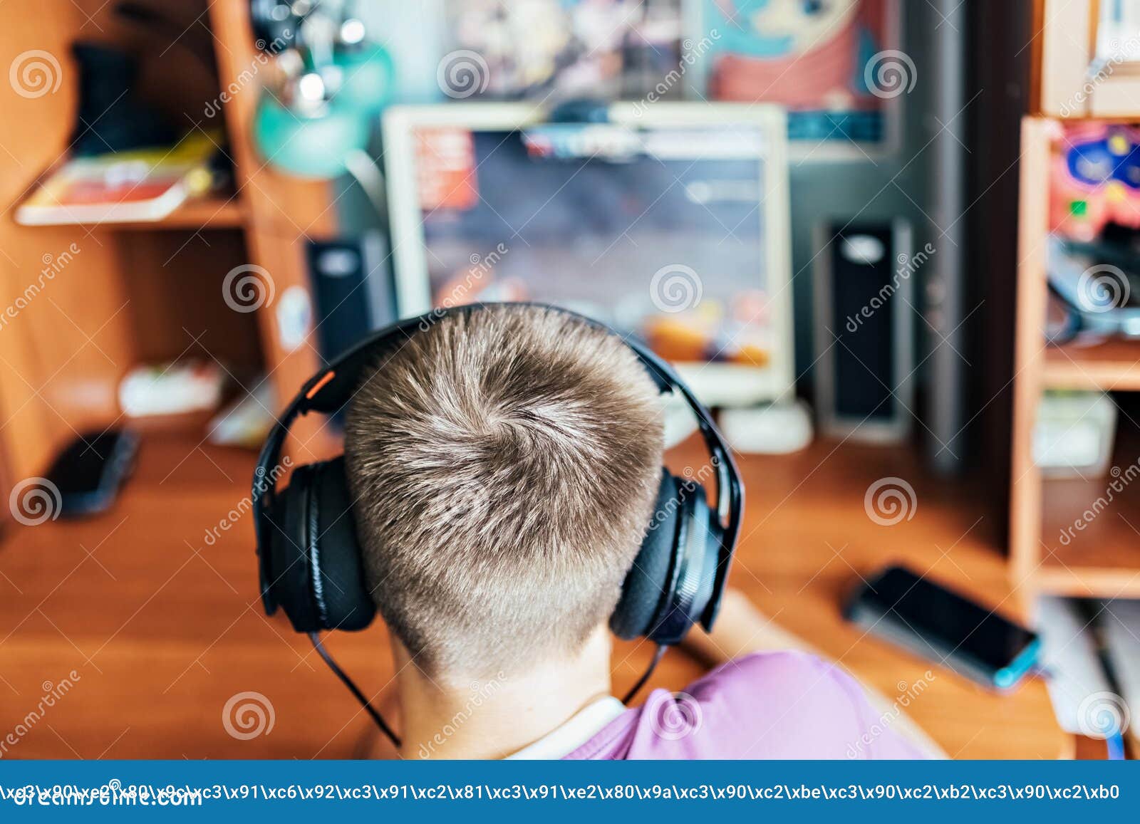 A Teenage Boy, a Young Man Playing Video Games on a Computer, Using ...
