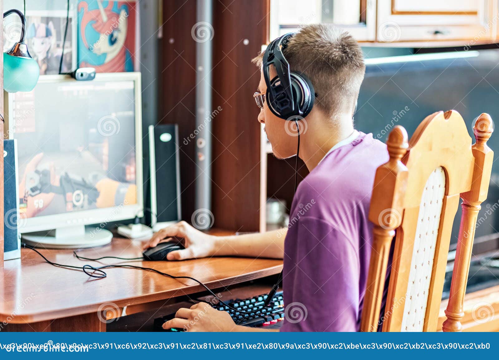 A Teenage Boy, a Young Man Playing Video Games on a Computer, Using ...