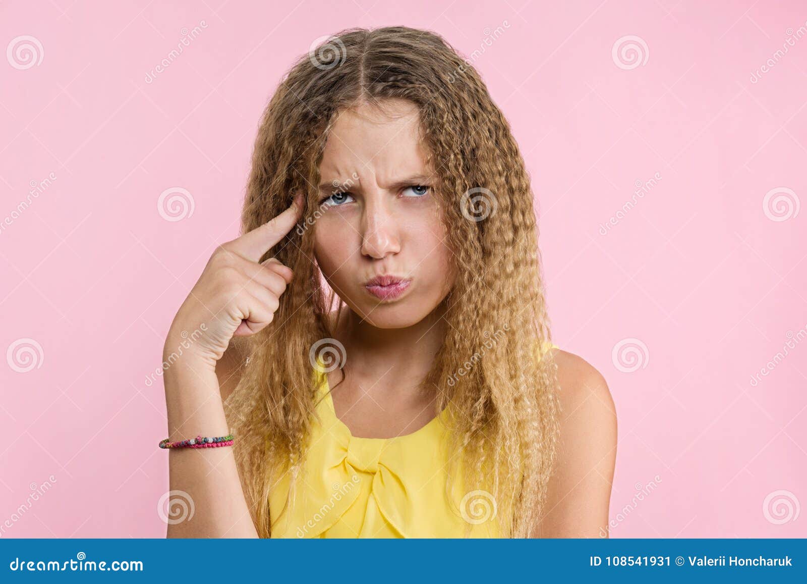 Teenage Girl Blonde with Curly Hair Frowning, Frowning Her Eyebrow ... Teenage Girl Blonde with Curly Hair Frowning, Frowning Her Eyebrow ...