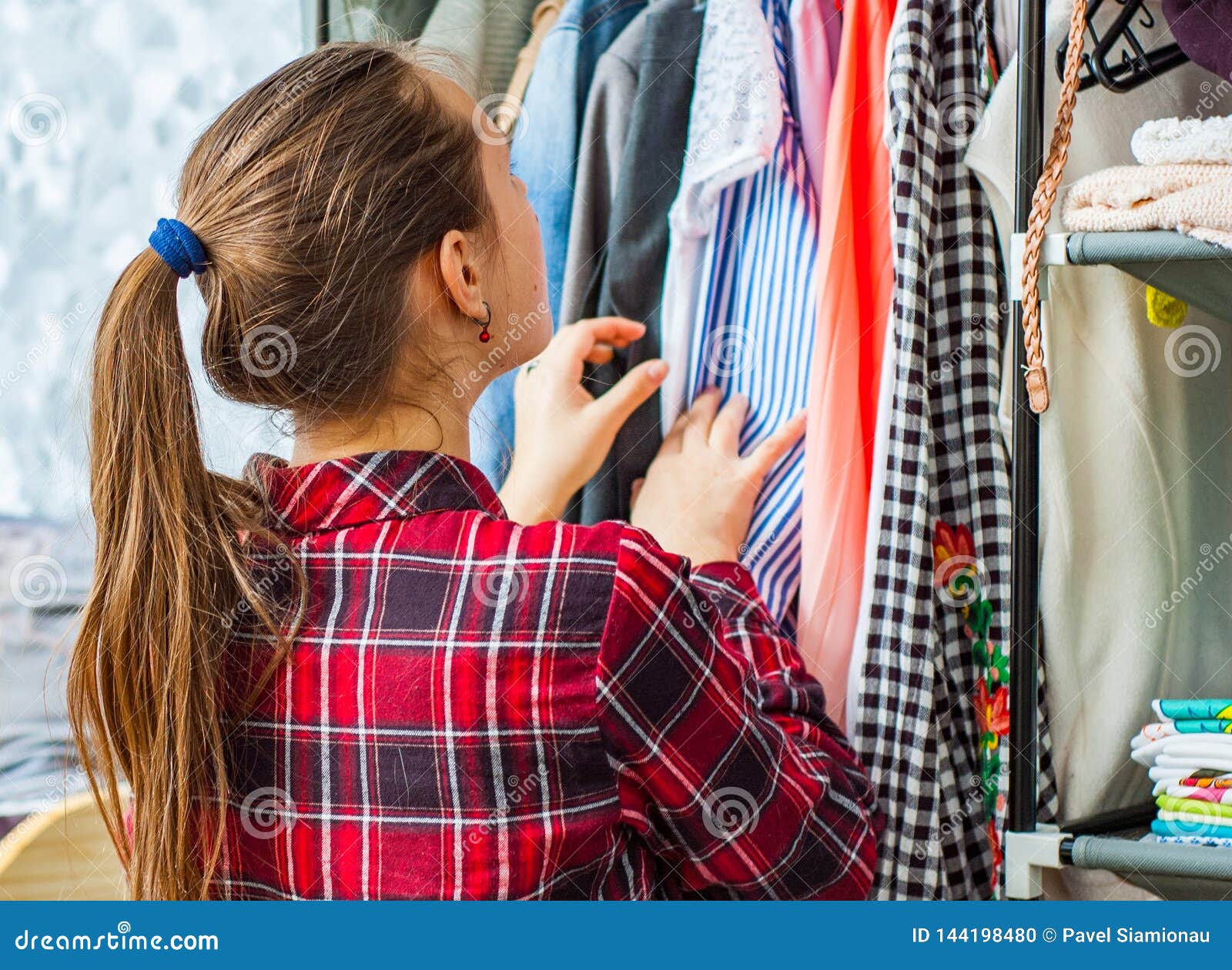 Teenage Girl Choosing Clothes Stock Photo - Image of hanger, nursery ... Teenage Girl Choosing Clothes Stock Photo - Image of hanger, nursery ...