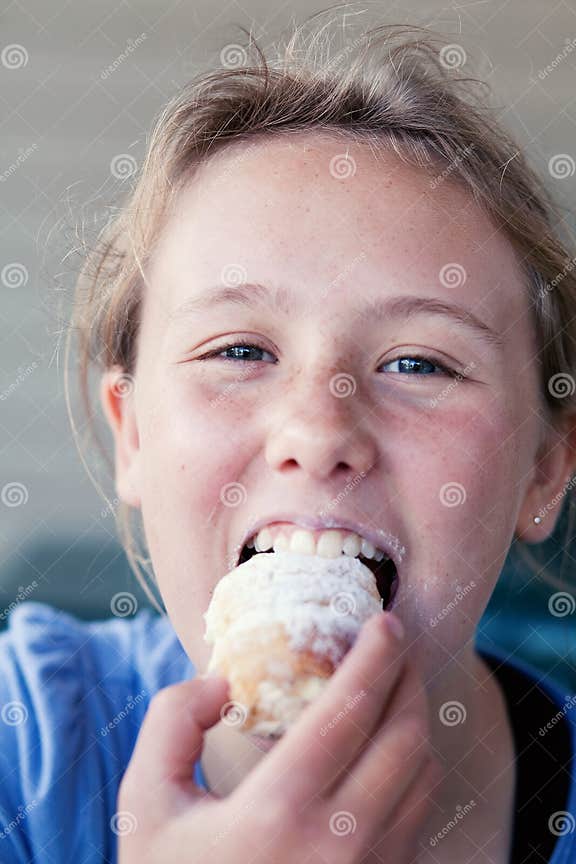 Teenage Girl Eating A Sugary Pastry Stock Image Image Of Girl Junk