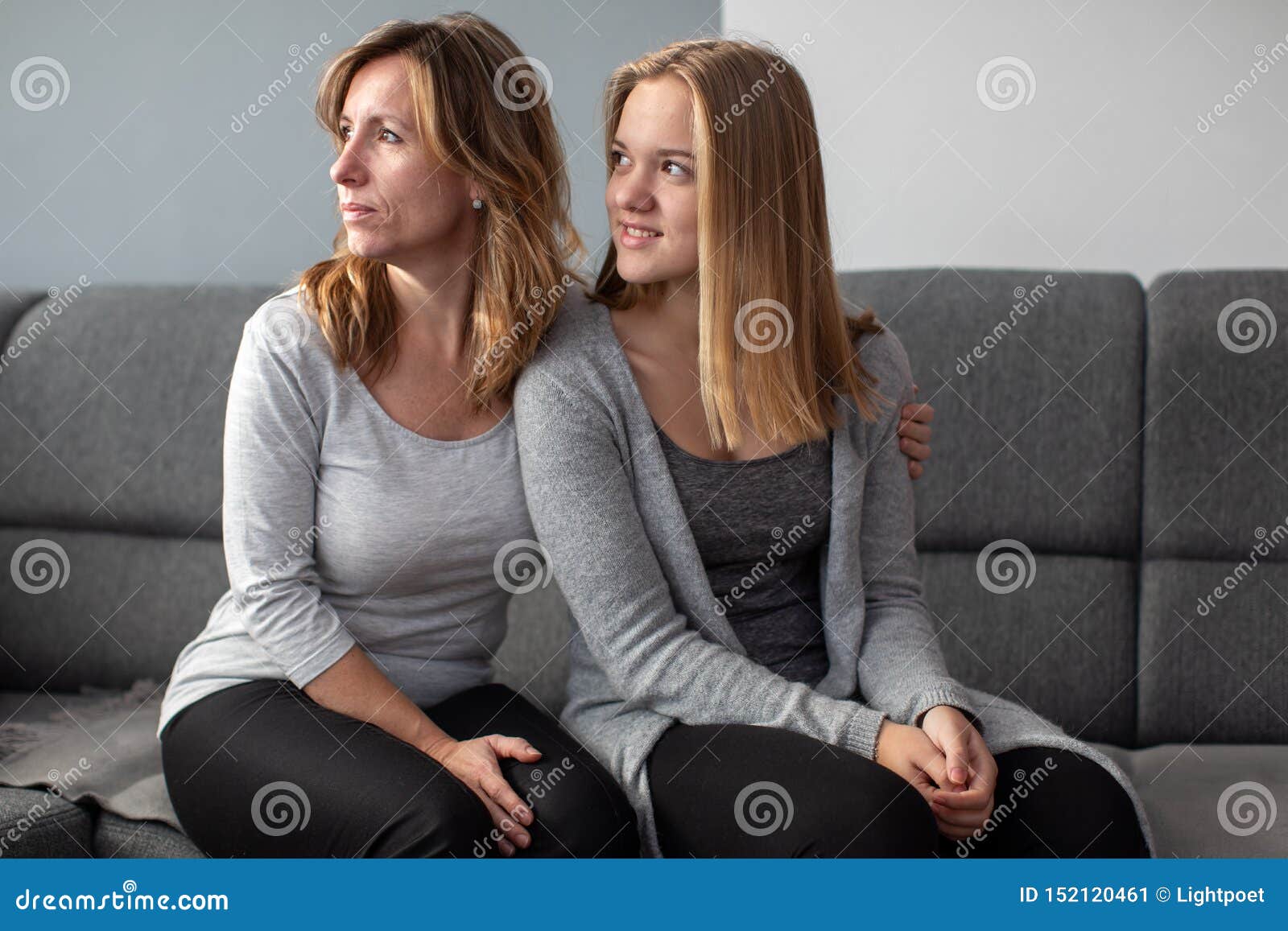 Teenage Girl With Her Mother On A Sofa Stock Image Image Of Helping