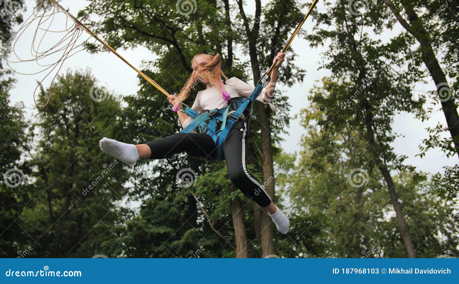 Teenage Girl Jumping on the Trampoline Bungee. Stock Image - Image of ... Teenage Girl Jumping on the Trampoline Bungee. Stock Image - Image of ...