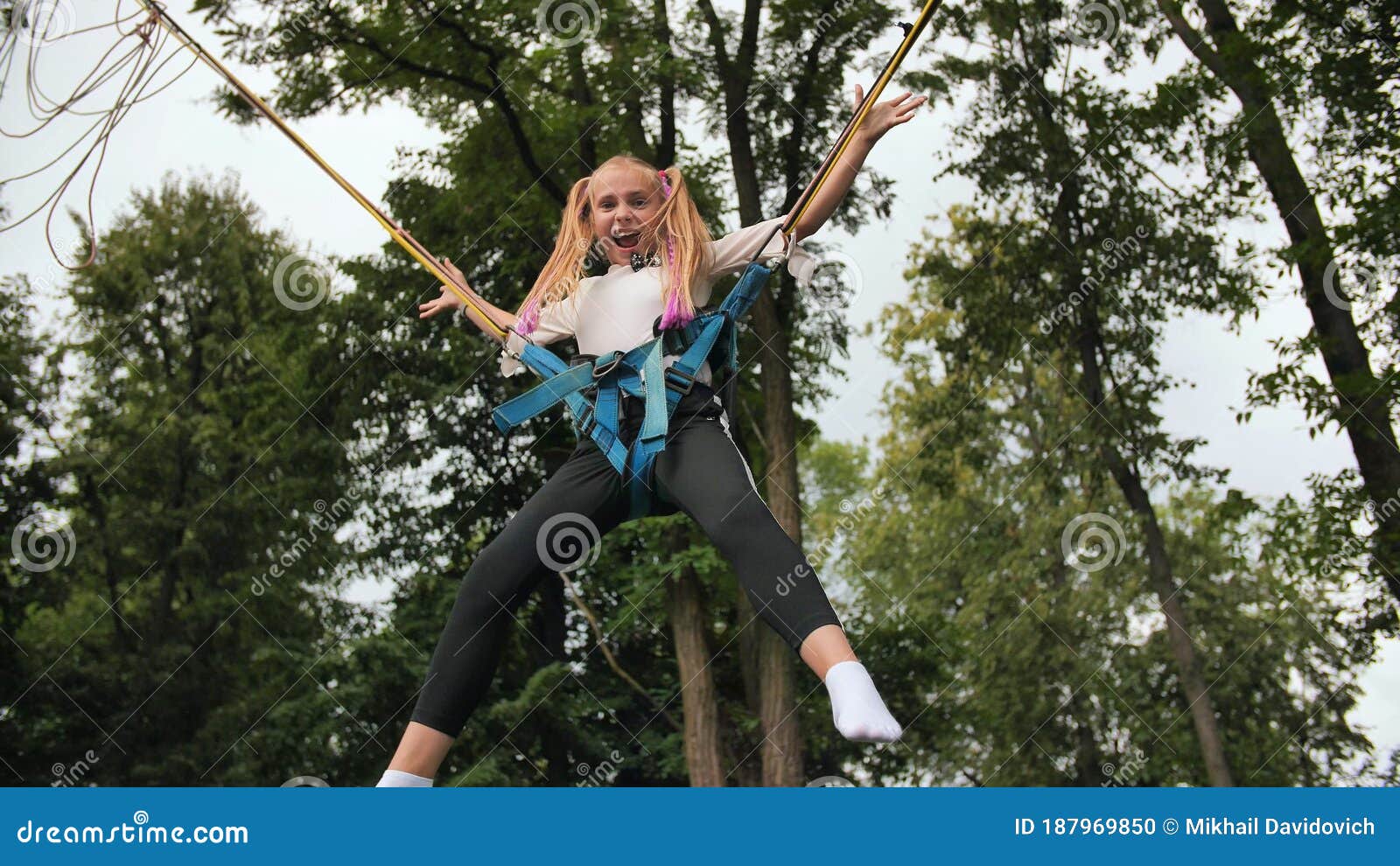 Teenage Girl Jumping on the Trampoline Bungee. Stock Photo - Image of ... Teenage Girl Jumping on the Trampoline Bungee. Stock Photo - Image of ...