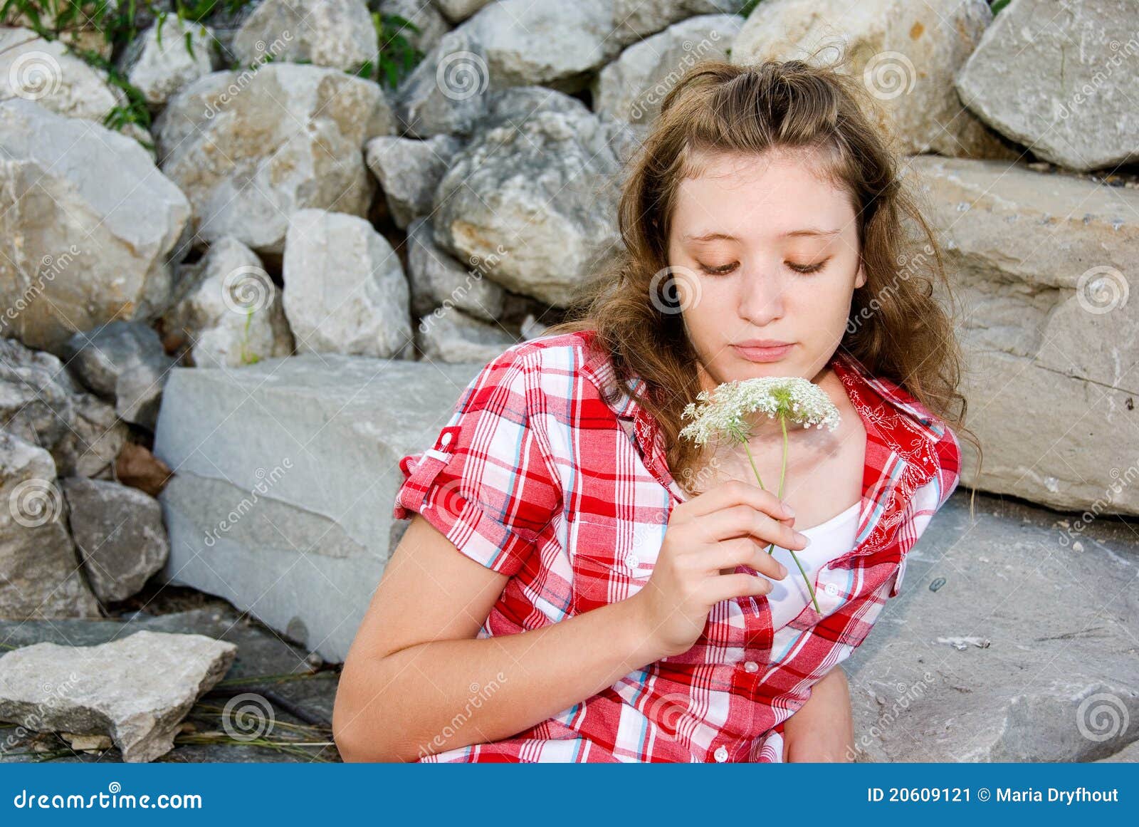 Teenage girl on the rocks stock image. Image of boulder - 20609121