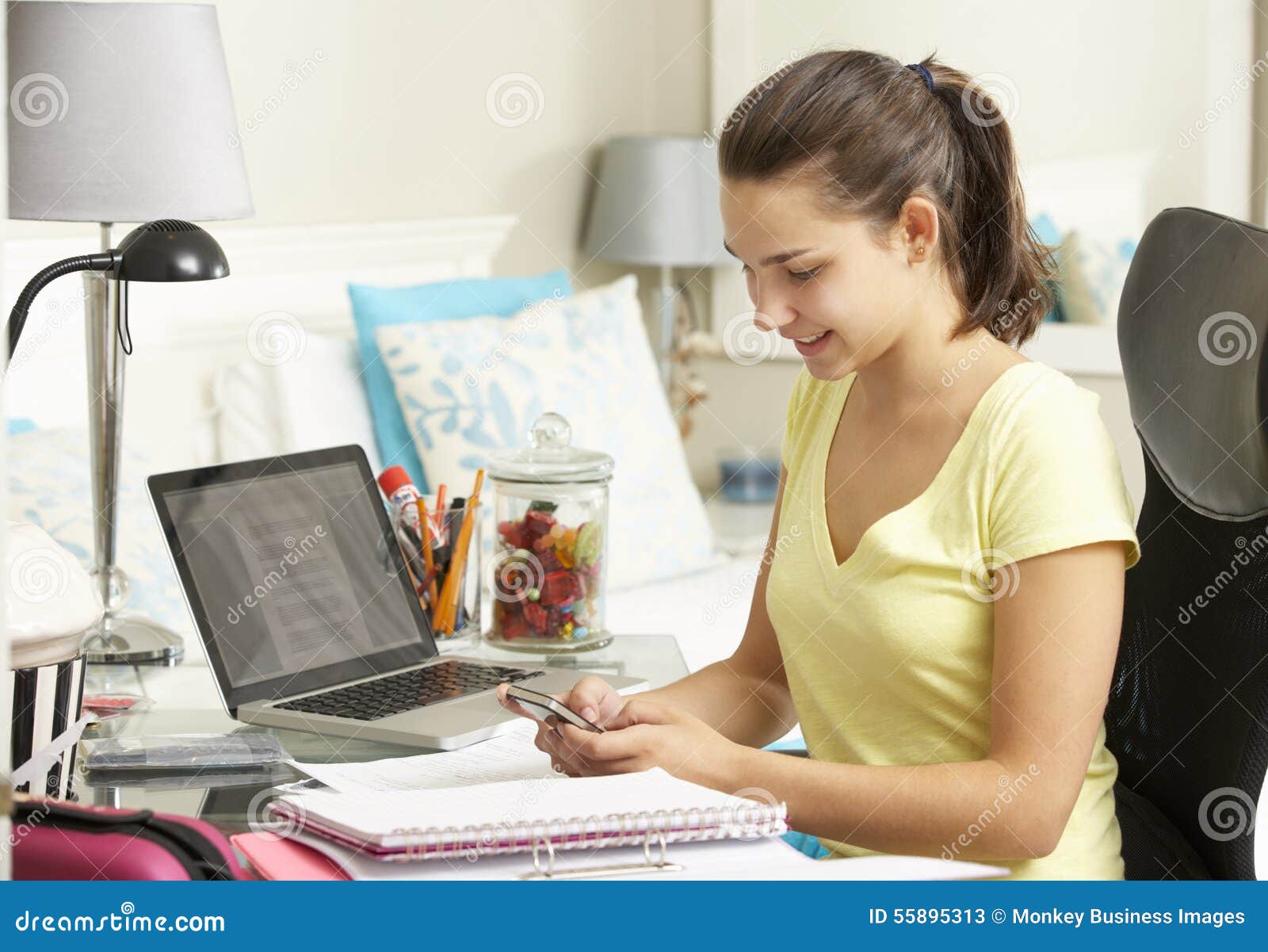 Teenage Girl Studying at Desk in Bedroom Using Mobile Phone Stock Image ... Teenage Girl Studying at Desk in Bedroom Using Mobile Phone Stock Image ...