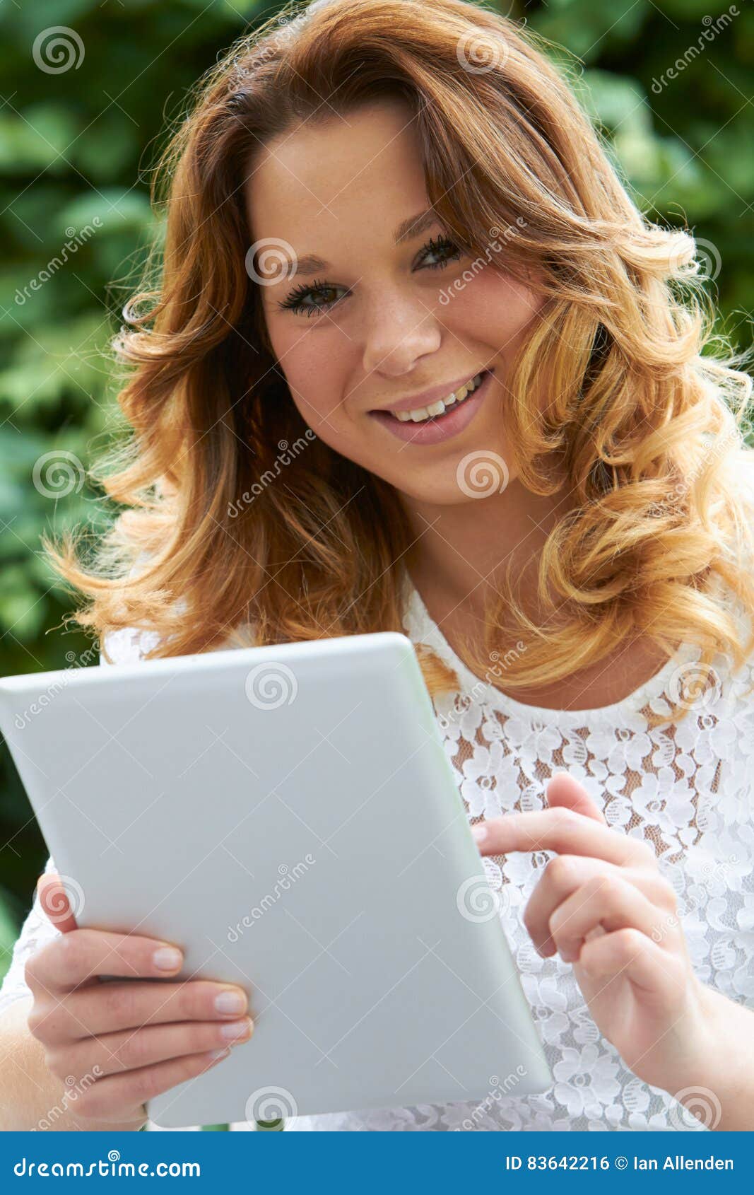 Teenage Girl Using Digital Tablet Outdoors Stock Photo - Image of ...