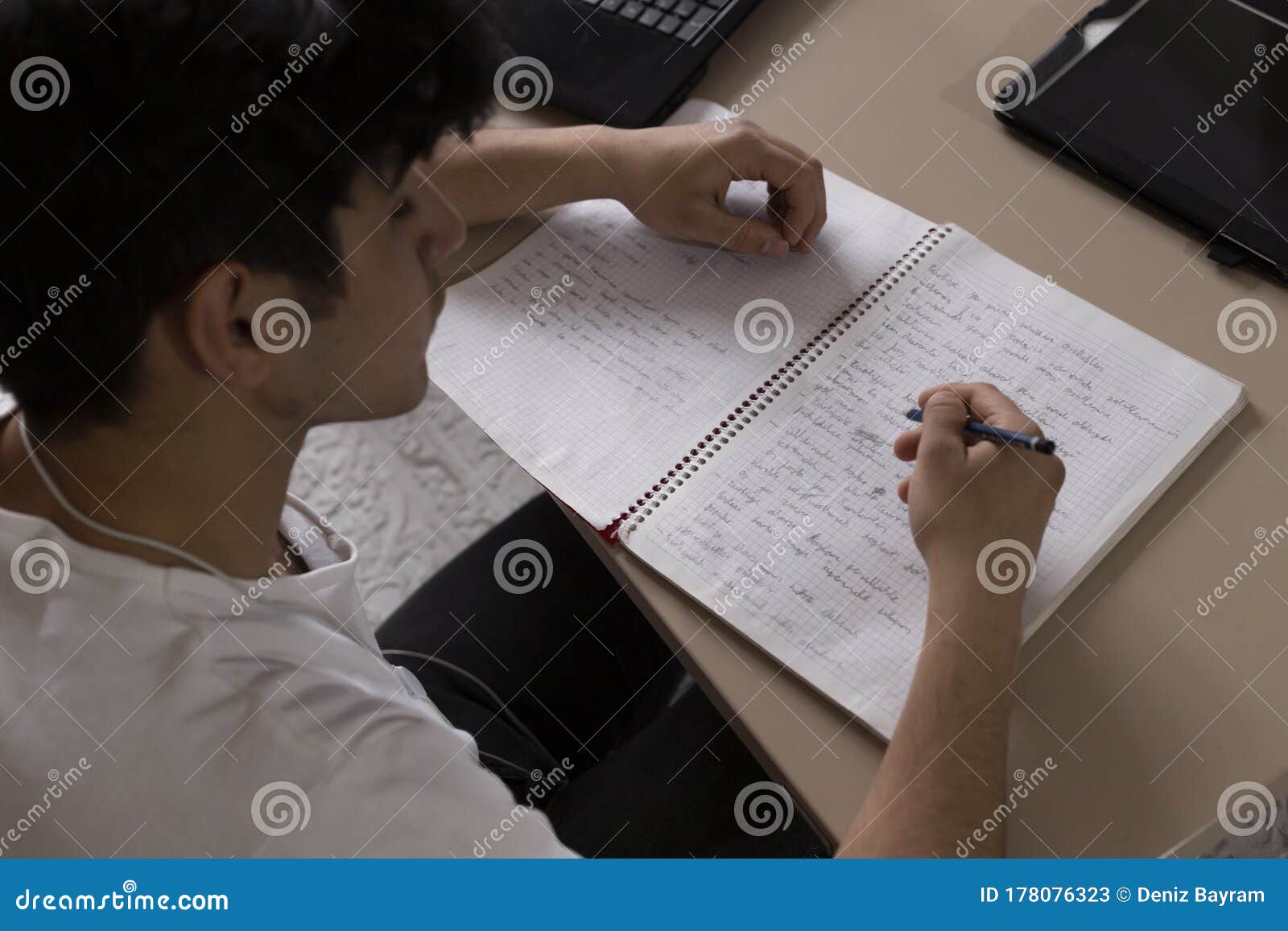 Teenage Student Studying at Home Using His Tablet and Computer Stock ...