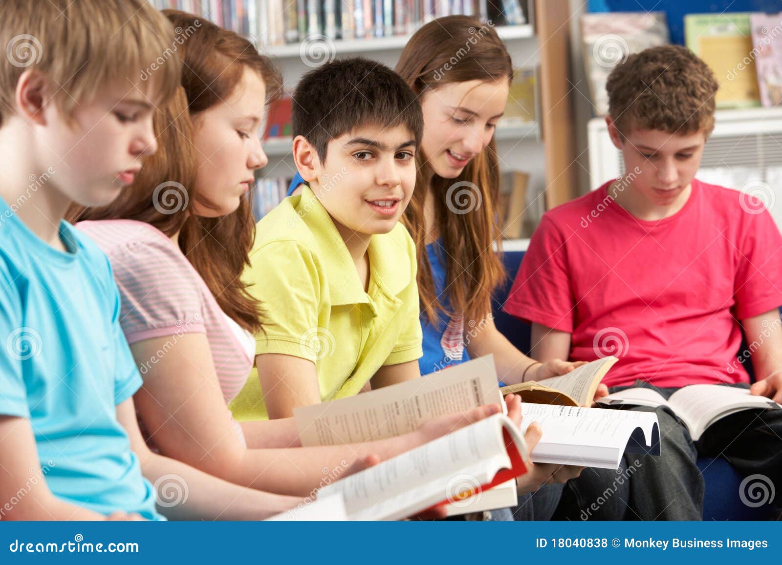Teenage Students in Library Reading Books Stock Photo - Image of male ...
