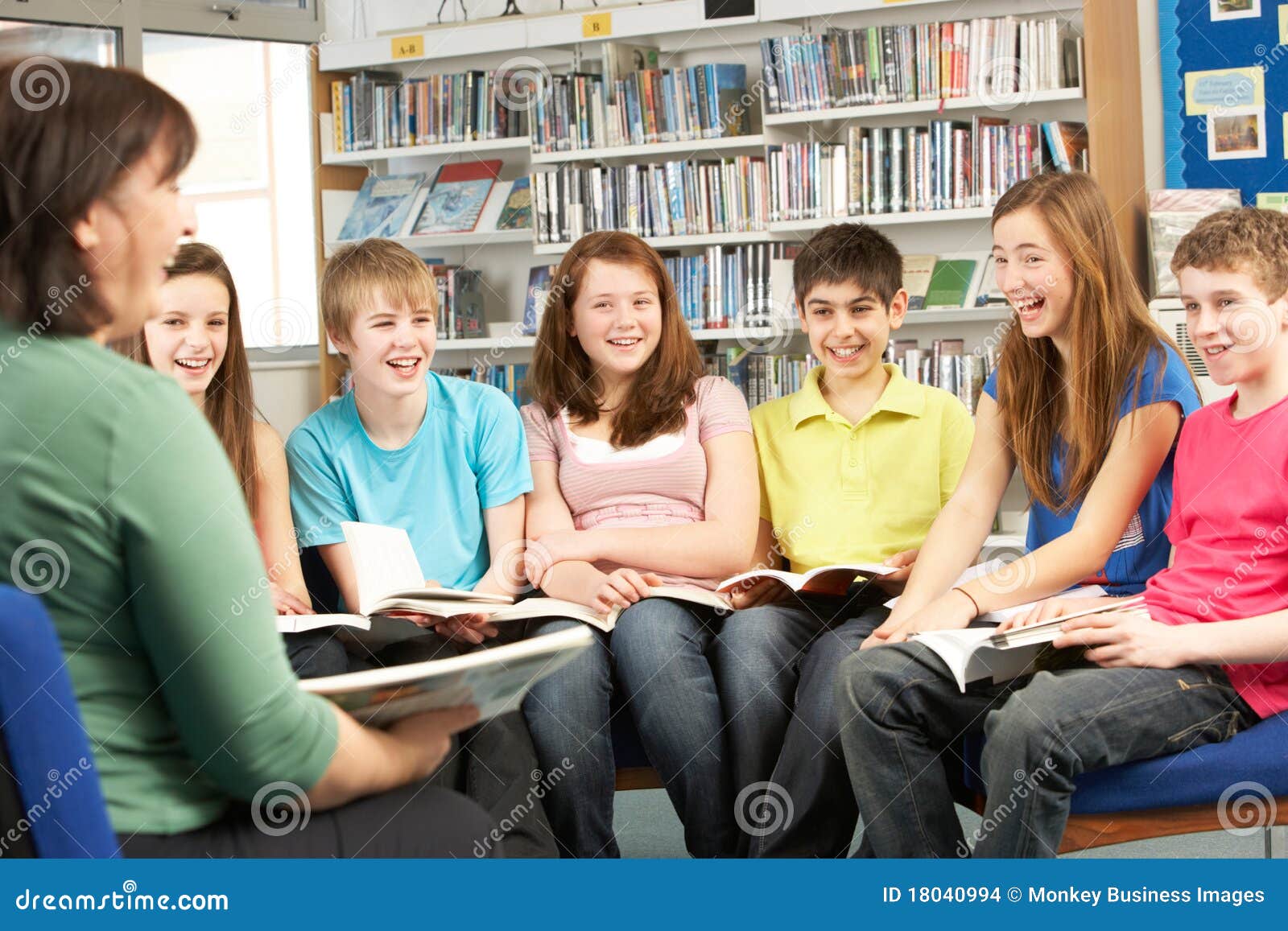 Teenage Students in Library Reading Books Stock Photo - Image of ...