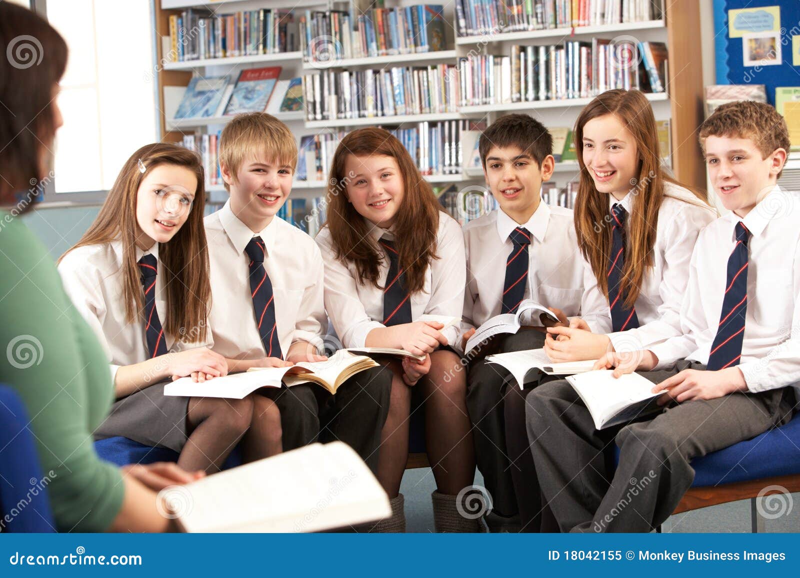 Teenage Students in Library Reading Books Stock Image - Image of ...