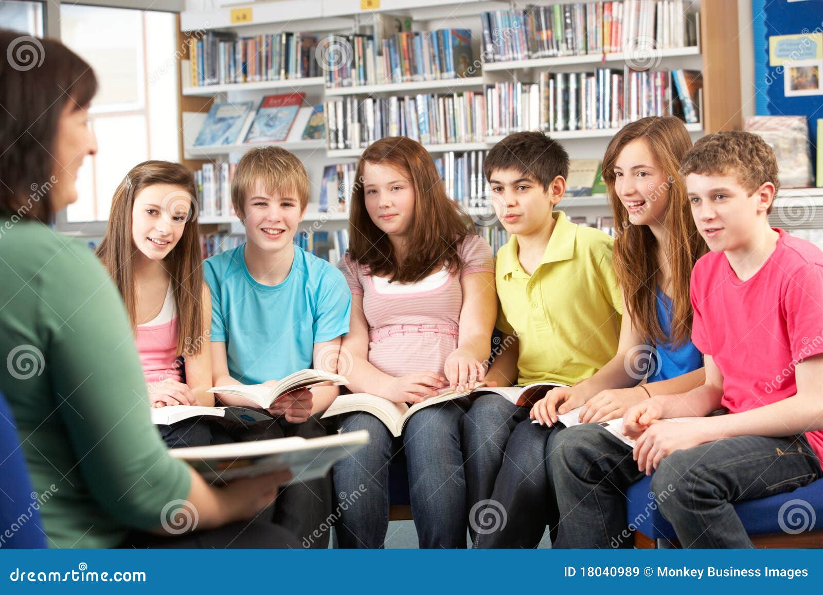 Teenage Students in Library Reading Bookss Stock Image - Image of ...