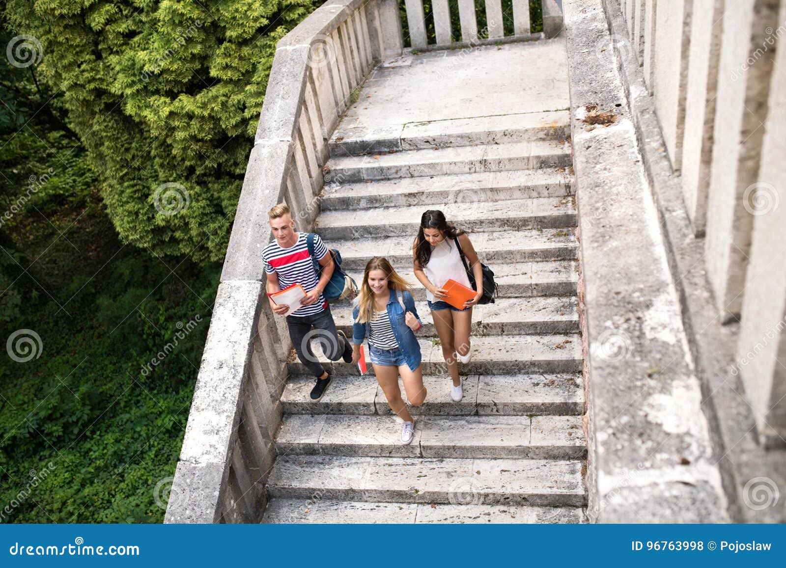 Teenage Students Walking on Stone Steps in Front of University. Stock ...