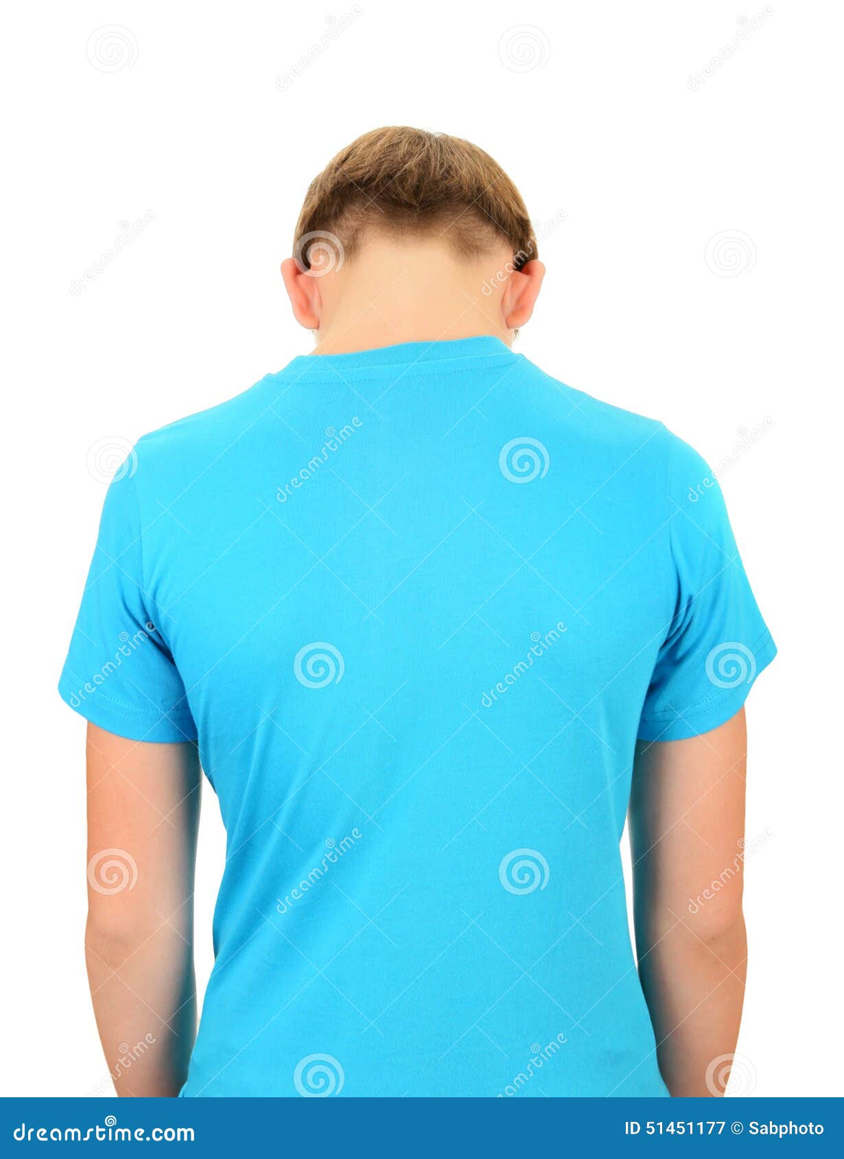 Teenager Back Sitting In The Sand On The Beach And Looks At The Sea ...