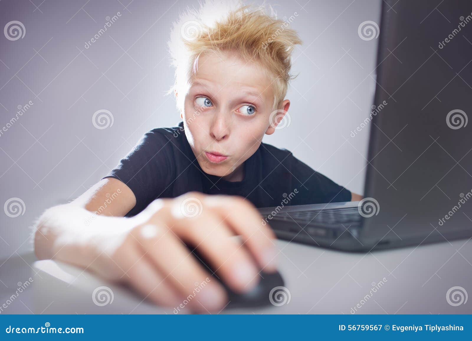 Teenager behind a computer stock image. Image of young - 56759567