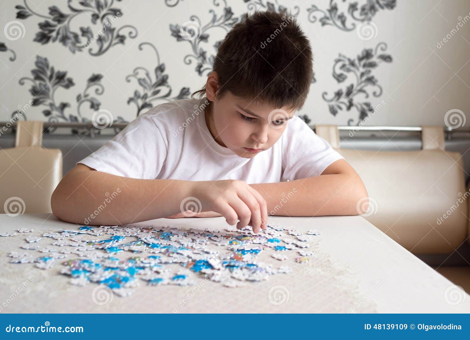 Teenager Boy Collects Puzzles at Table Stock Image - Image of happy ...