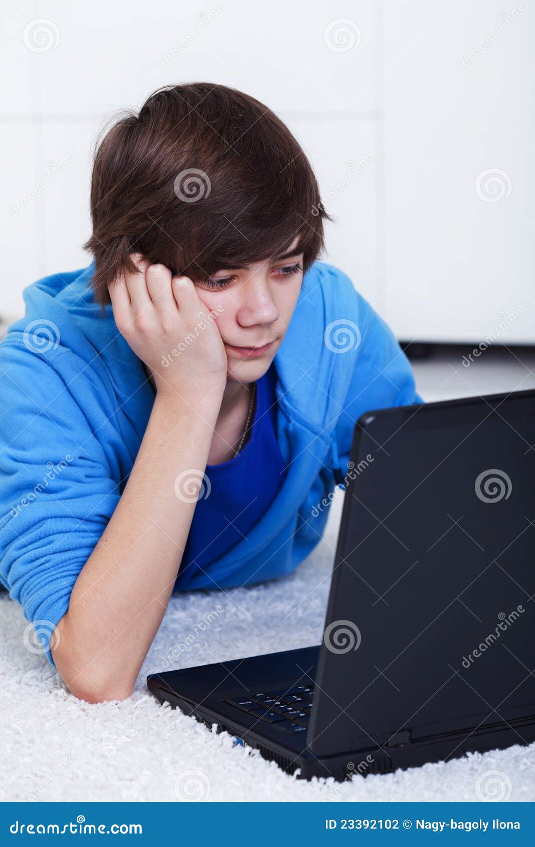 Teenager boy with laptop stock photo. Image of casual - 23392102