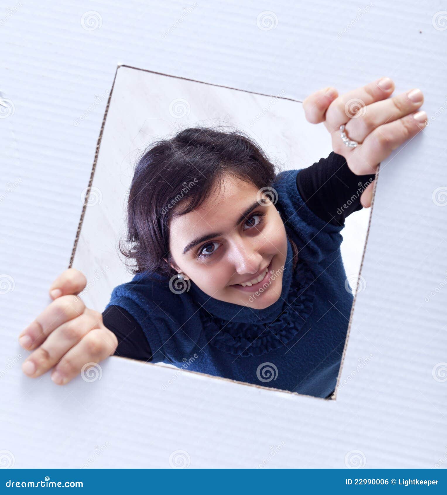 Teenager Breaking Out of the Box Stock Photo - Image of hands, hole ...