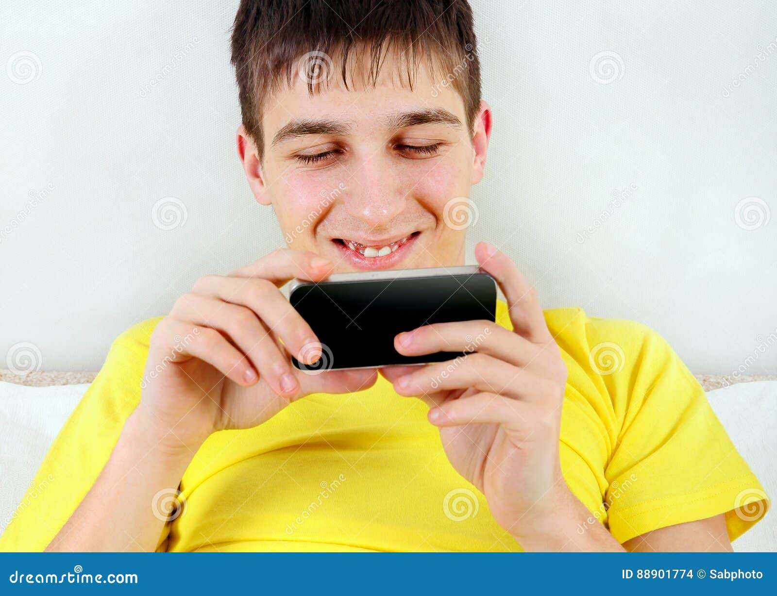 Teenager with Cellphone stock photo. Image of looking - 88901774