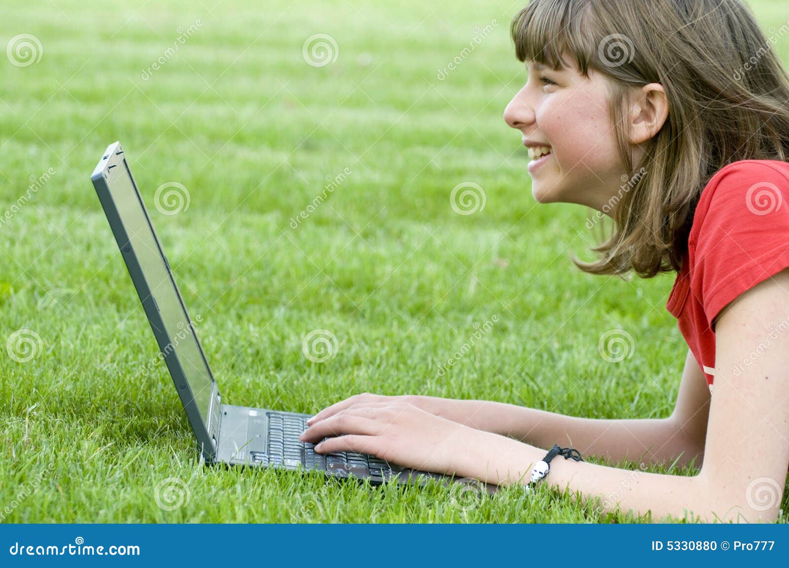 Teenager with Computer on the Grass Stock Photo - Image of nature ...