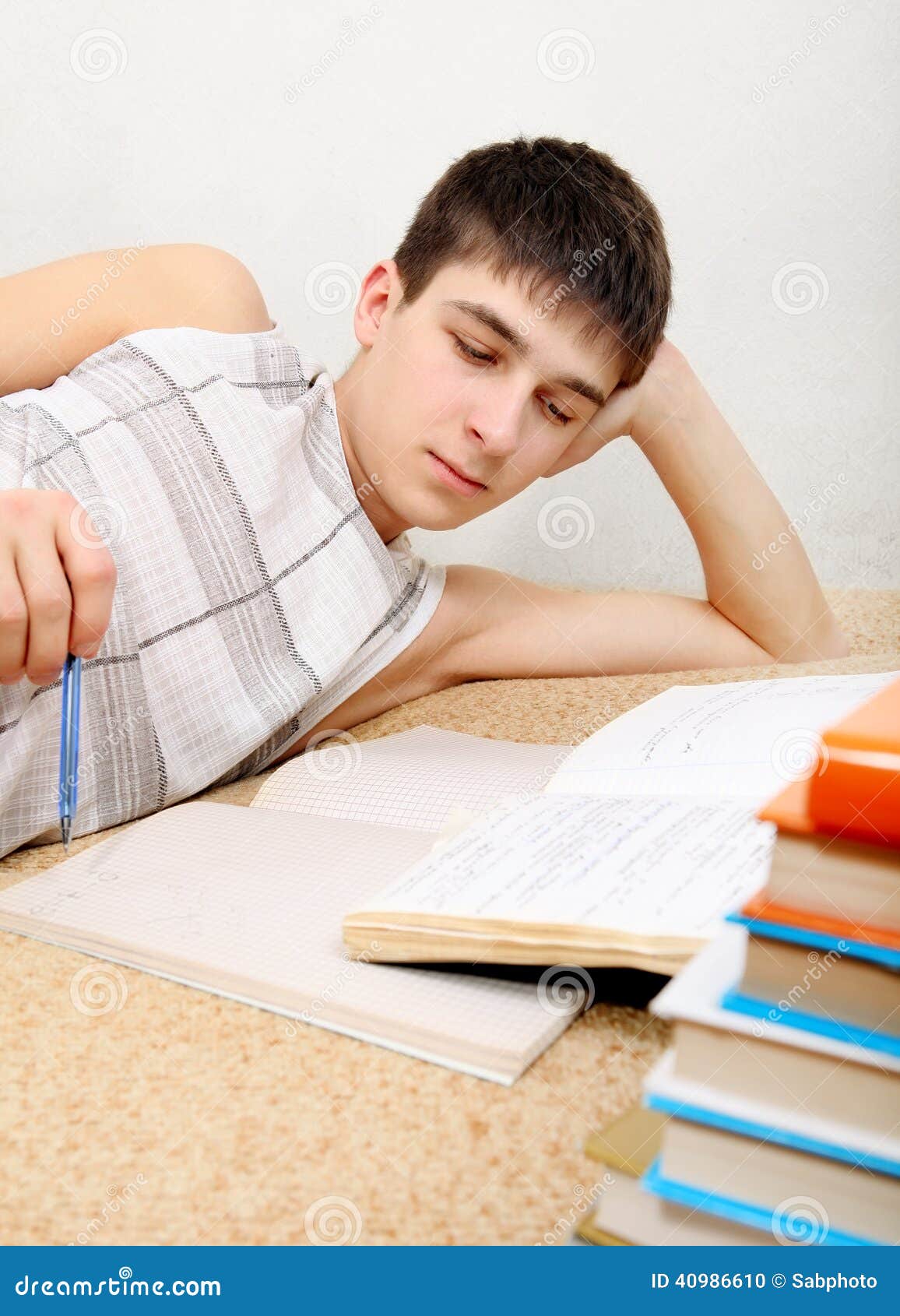 Teenager doing Homework stock photo. Image of paperwork - 40986610