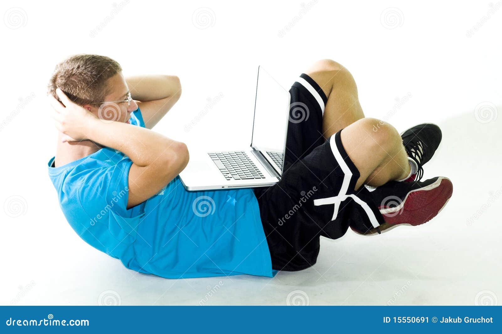 Teenager Exercising while Using His Laptop Stock Image - Image of ...