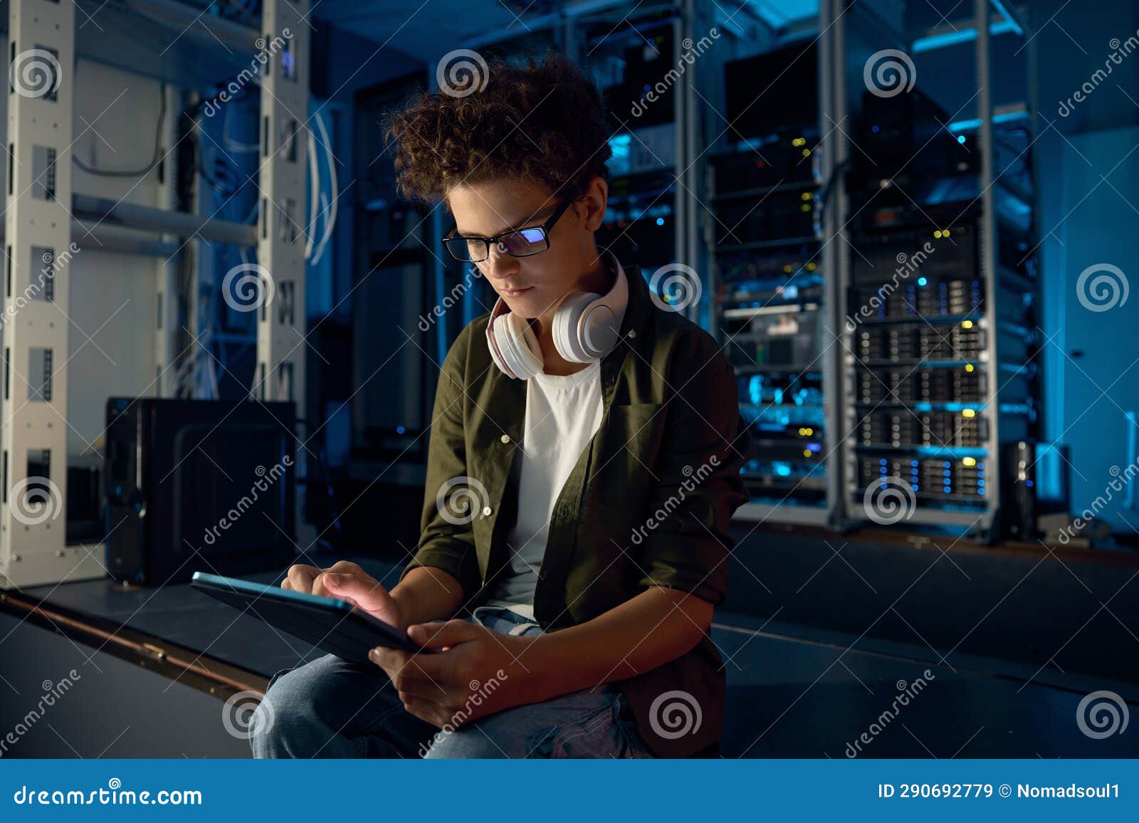 Teenager Guy it Technician Working on Tablet Inside Server Room Stock ...