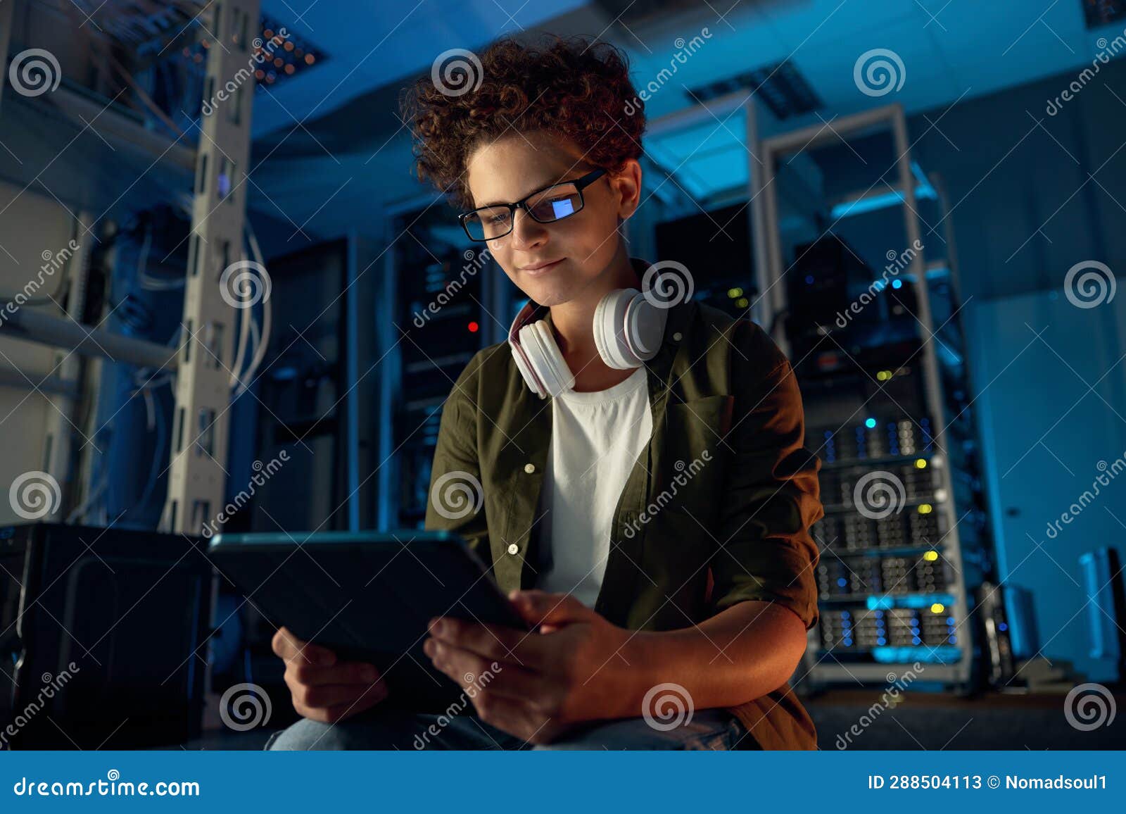 Teenager Guy it Technician Working on Tablet in Server Room Stock Image ...