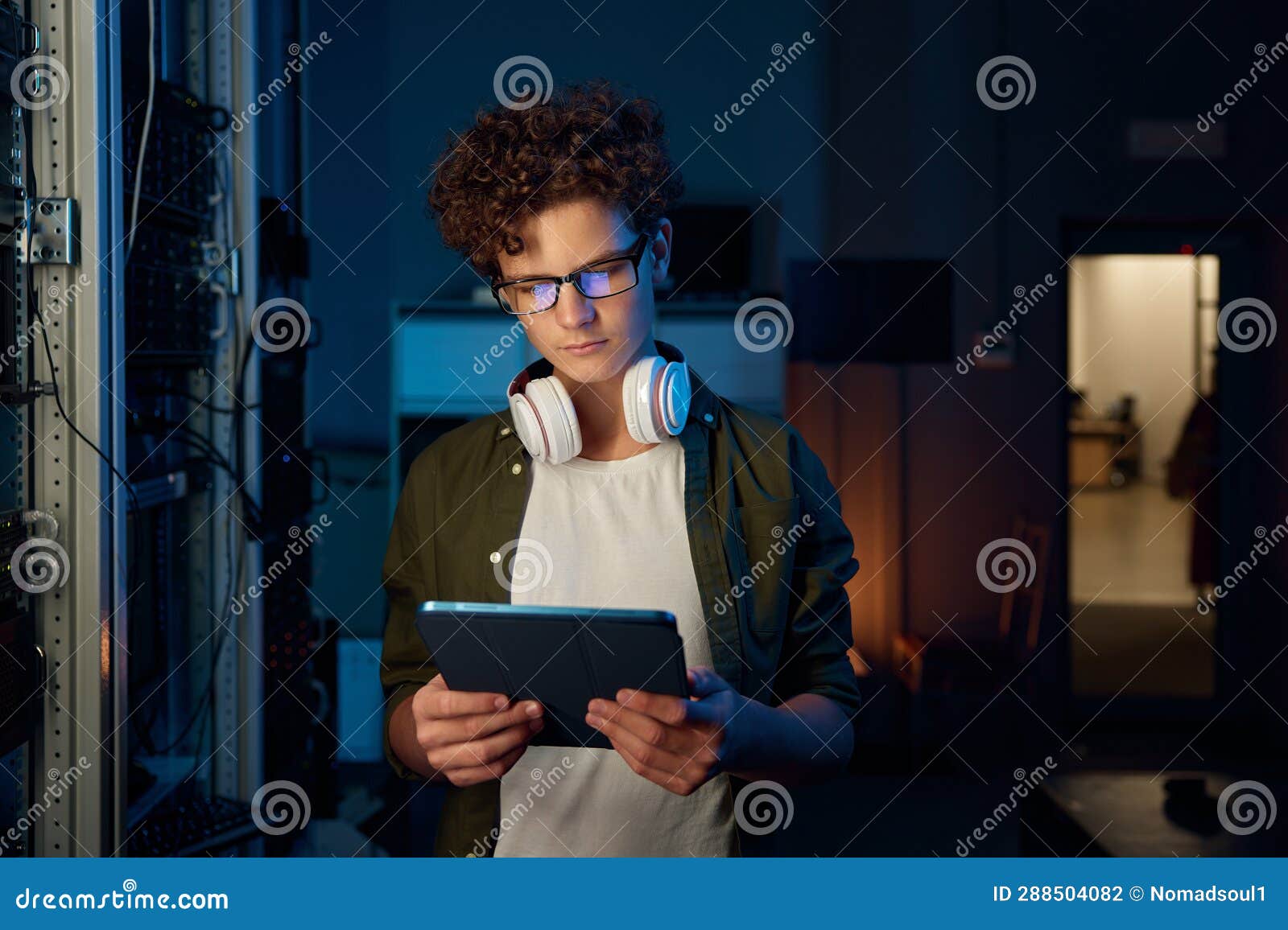 Teenager Guy it Technician Working on Tablet in Server Room Stock Photo ...