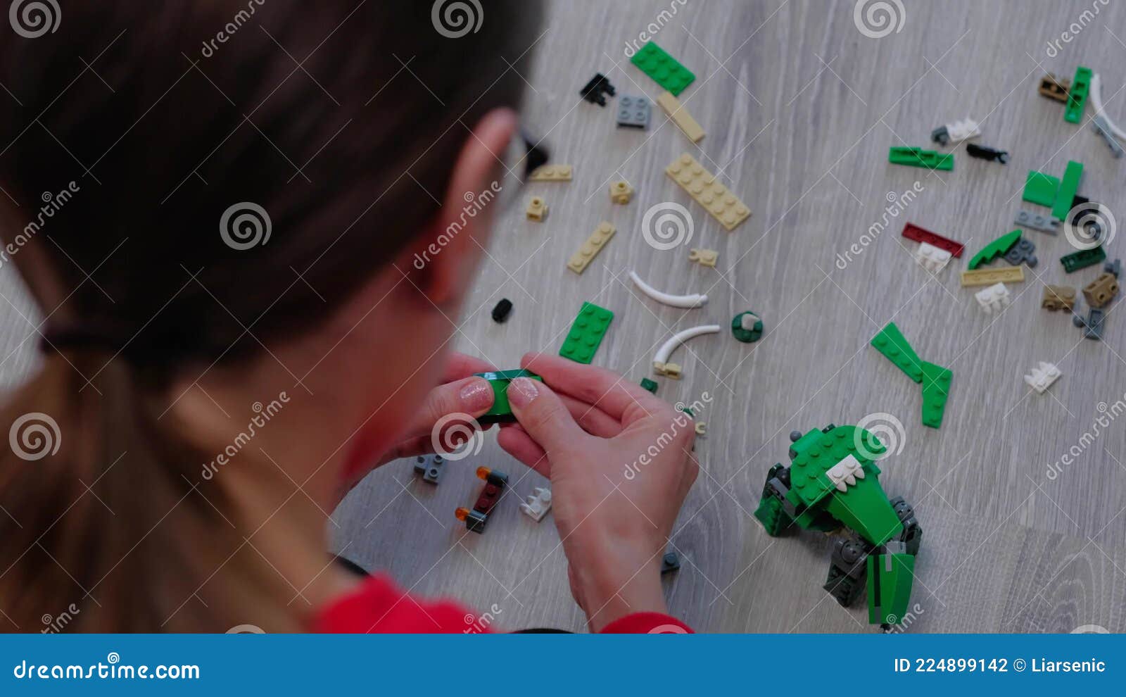 Teenager with Hands Constructs Lego Elements from Back View Stock ...