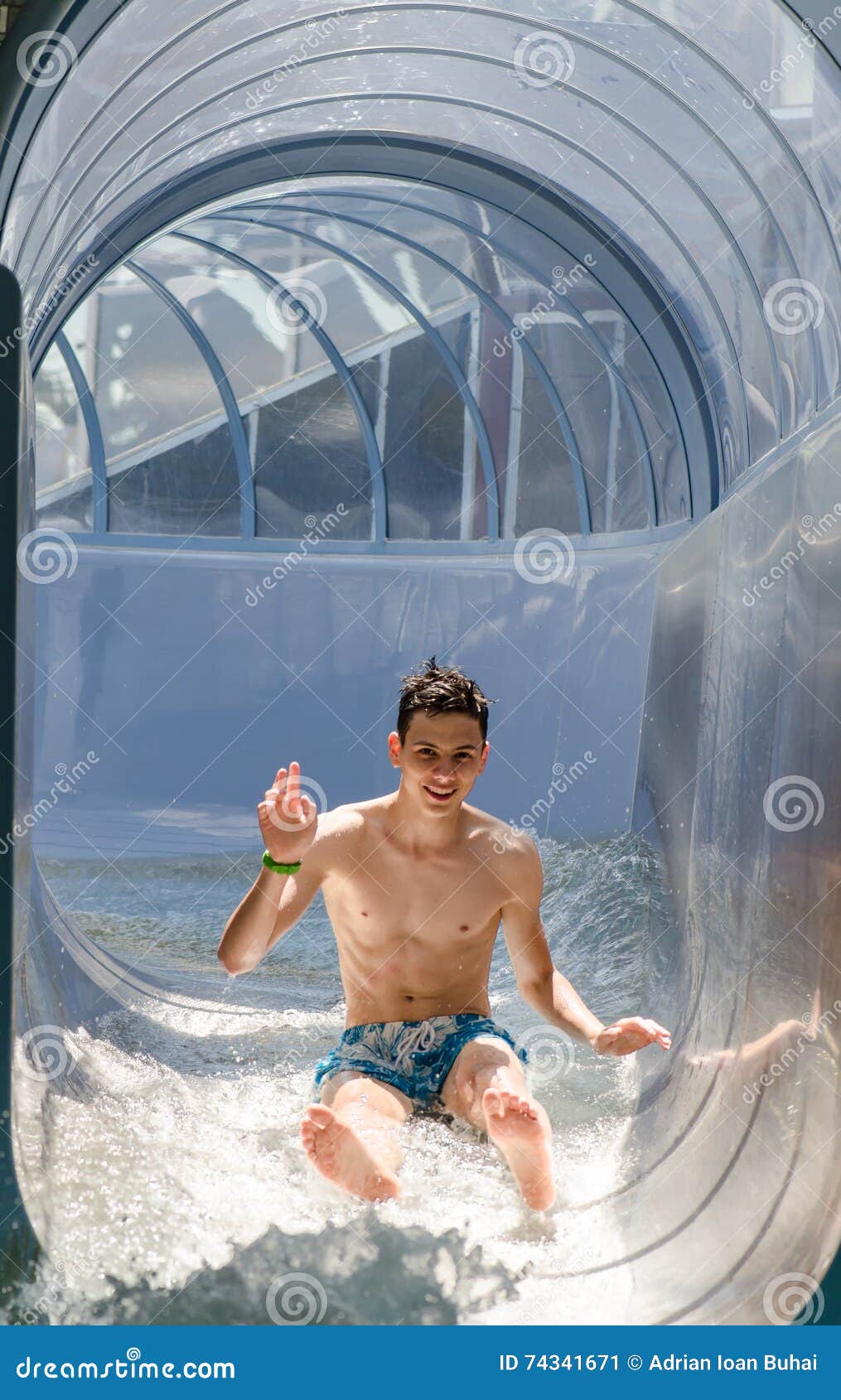 Teenager Man Going Down a Water Slide Stock Image - Image of blue, ride ...