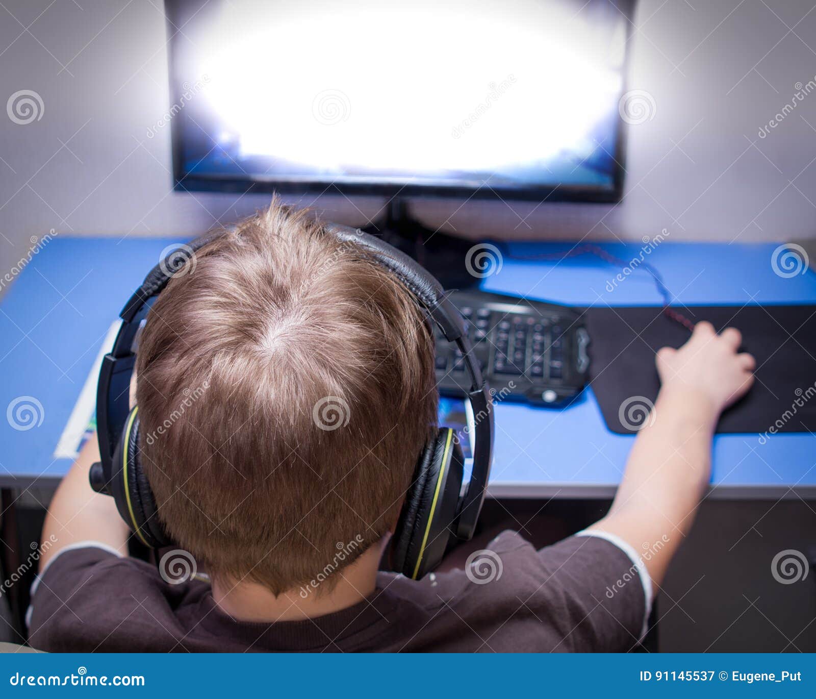 A Teenager Playing a Computer Game at Home Stock Image - Image of male ...