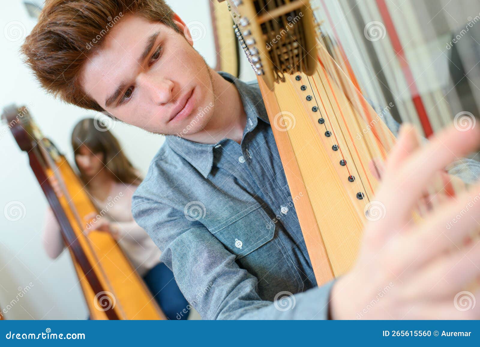 Teenager playing harp stock photo. Image of male, relaxation - 265615560