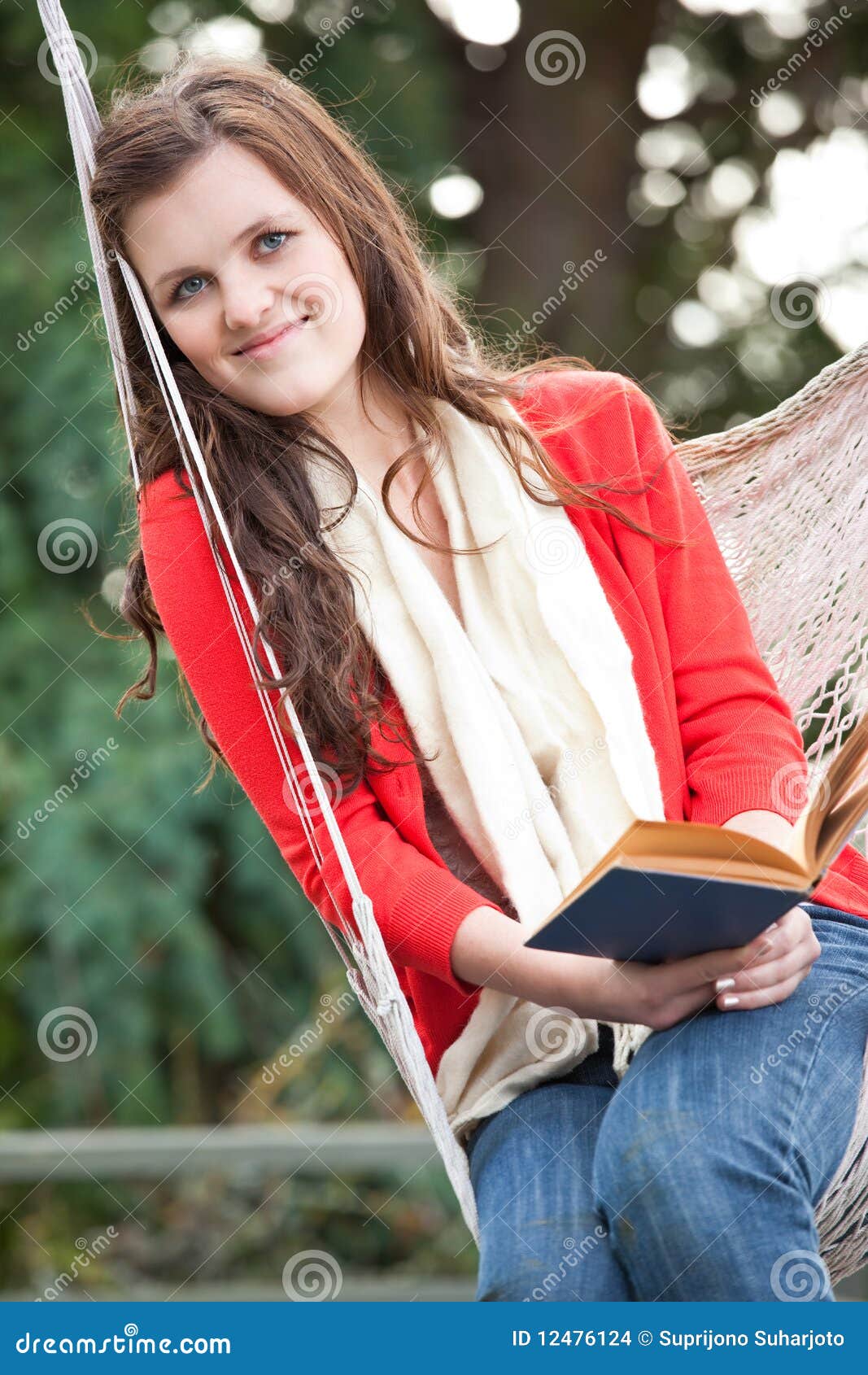 Teenager reading a book stock photo. Image of relaxation - 12476124