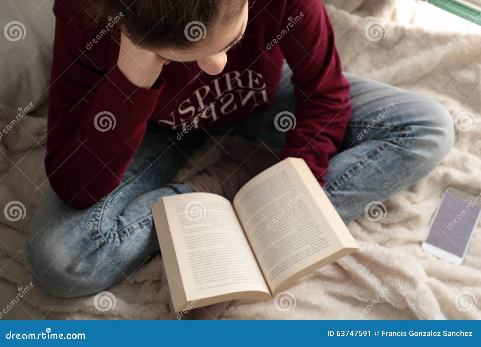 Teenager reading a book stock image. Image of student - 63747591