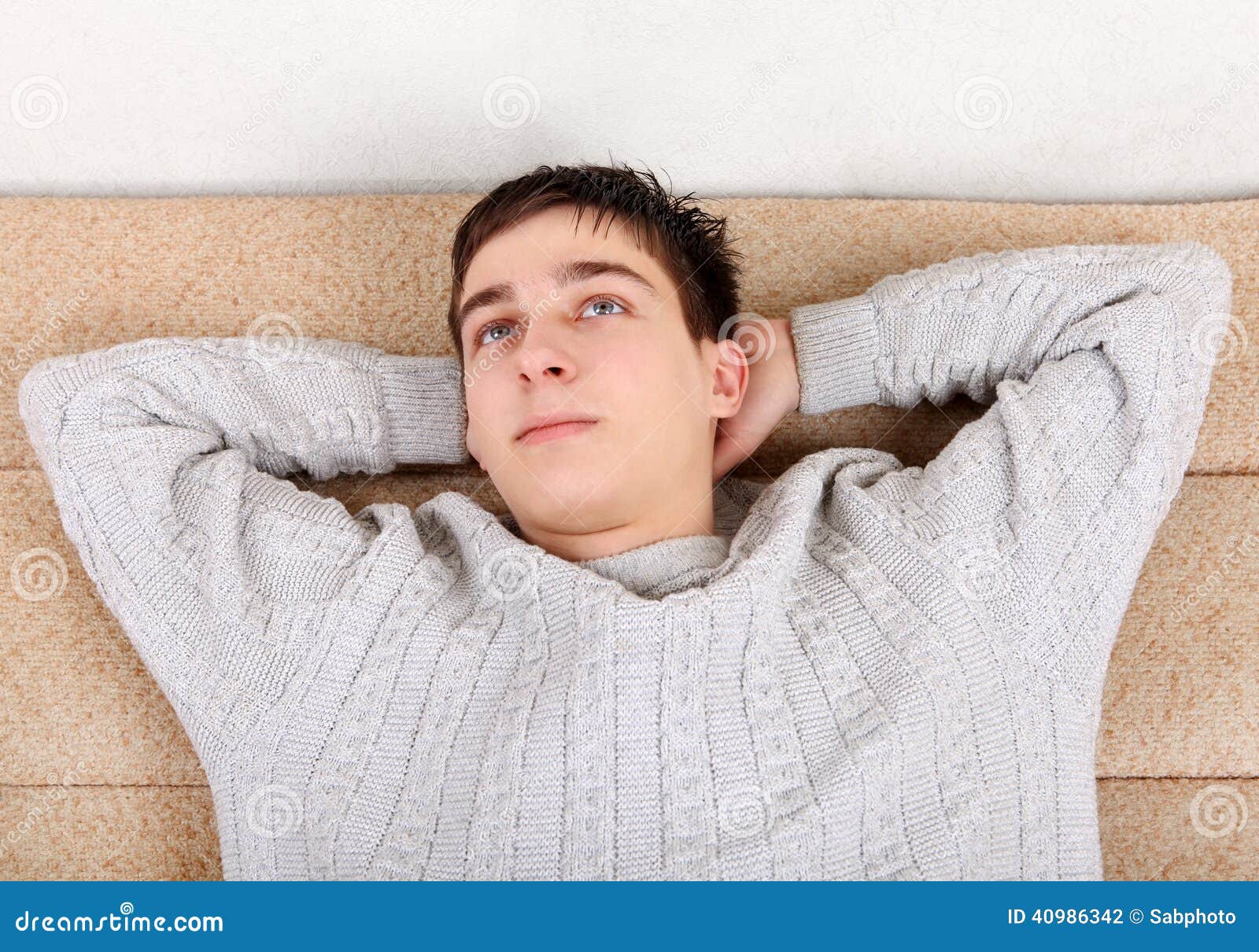 Teenager resting on Sofa stock photo. Image of closeup - 40986342