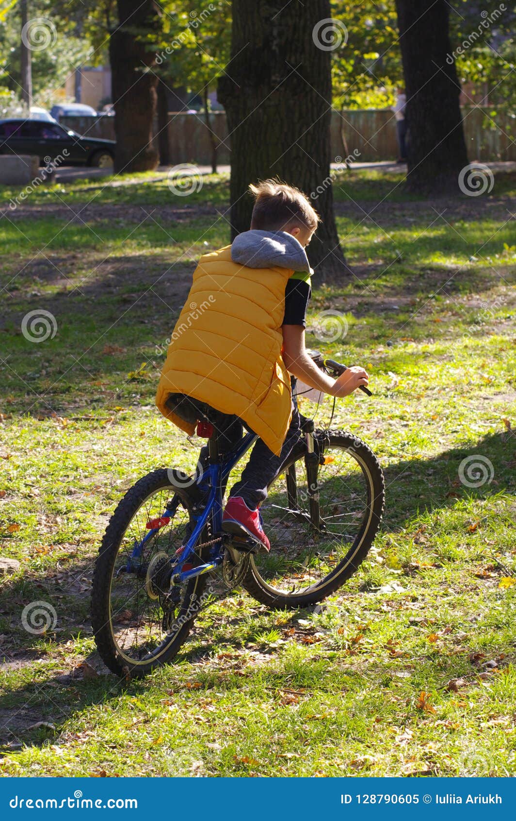 Teenager Riding a Bicycle in the Sun Stock Image - Image of riding ...