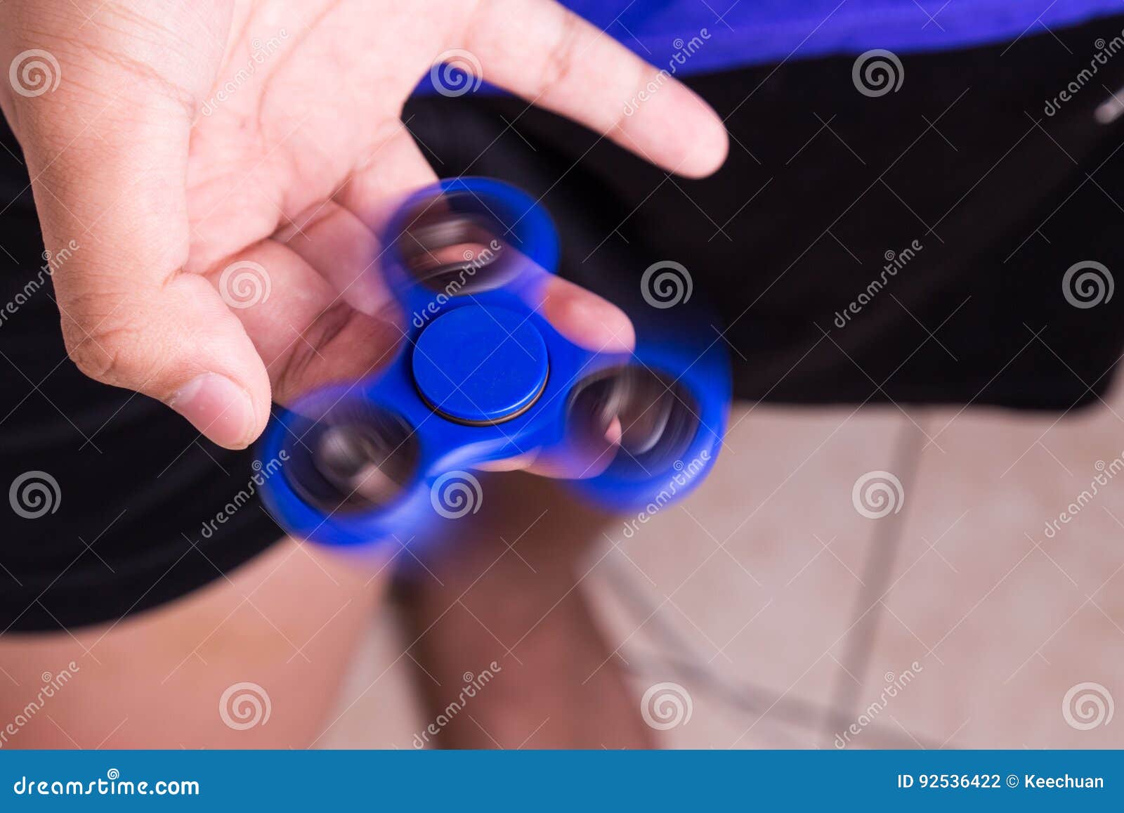 Teenager Spinning a Fidget Spinner on Finger Stock Photo - Image of ...