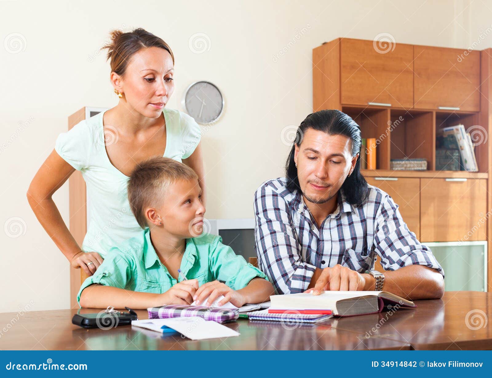Teenager Studying with Parents Stock Photo - Image of learning, people ...