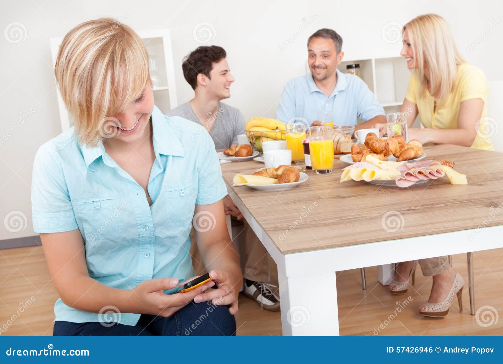 Teenager Texting in Kitchen Stock Photo - Image of family, eating: 57426946