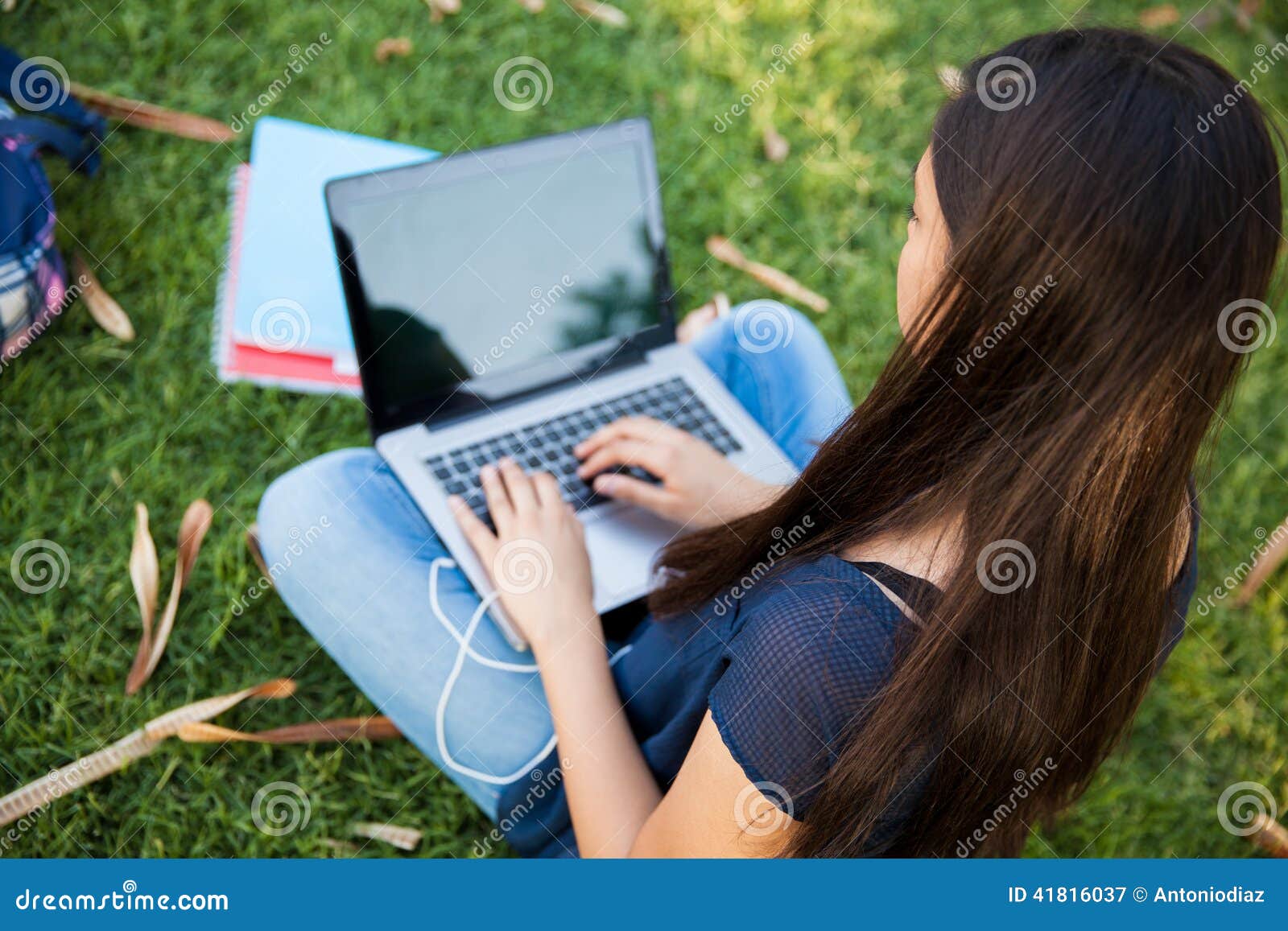 Teenager using a laptop stock image. Image of high, female - 41816037
