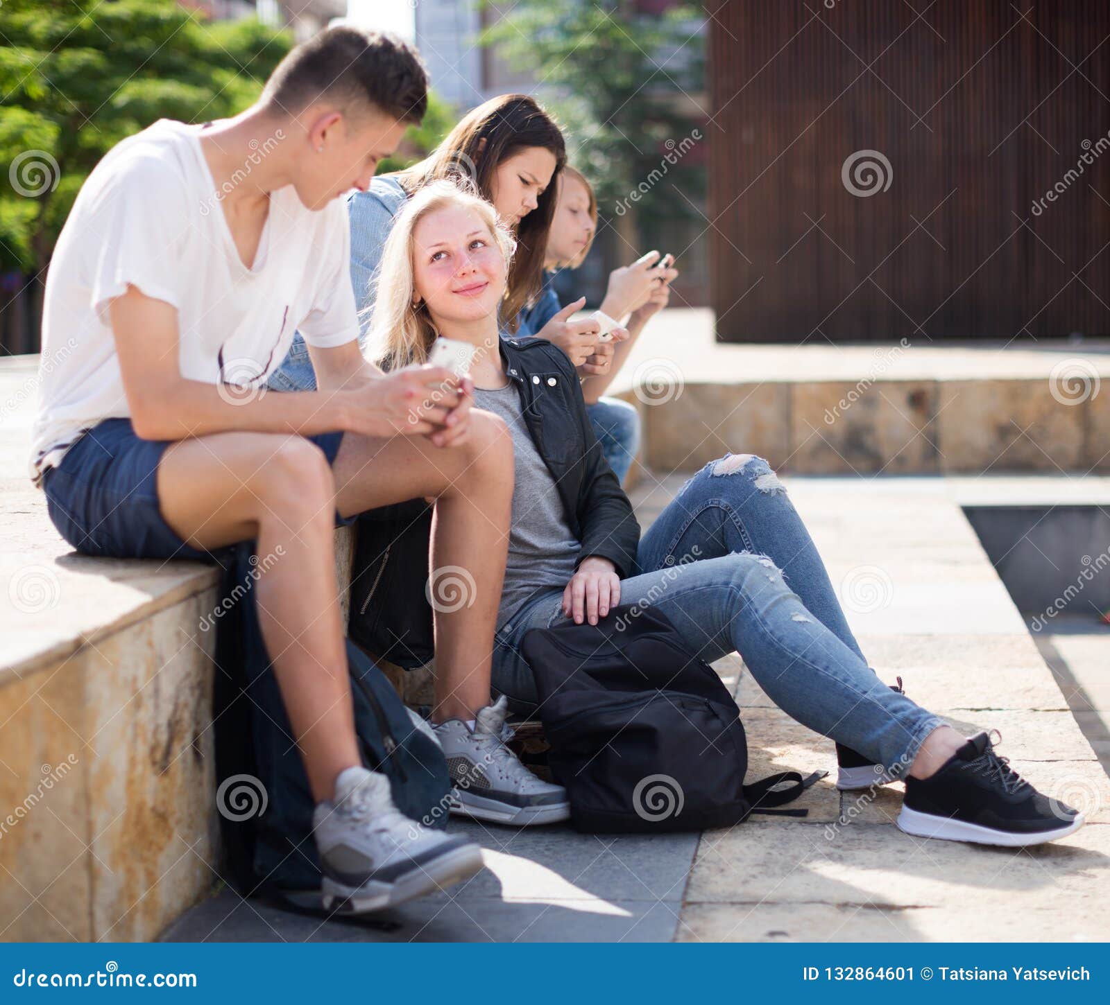 Teenagers Communicate in Schoolyard Stock Image - Image of modern ...