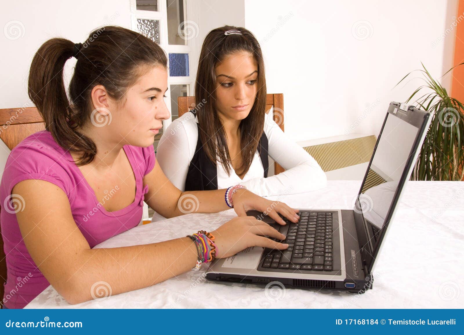 Teenagers with computer stock photo. Image of girls, concentration ...
