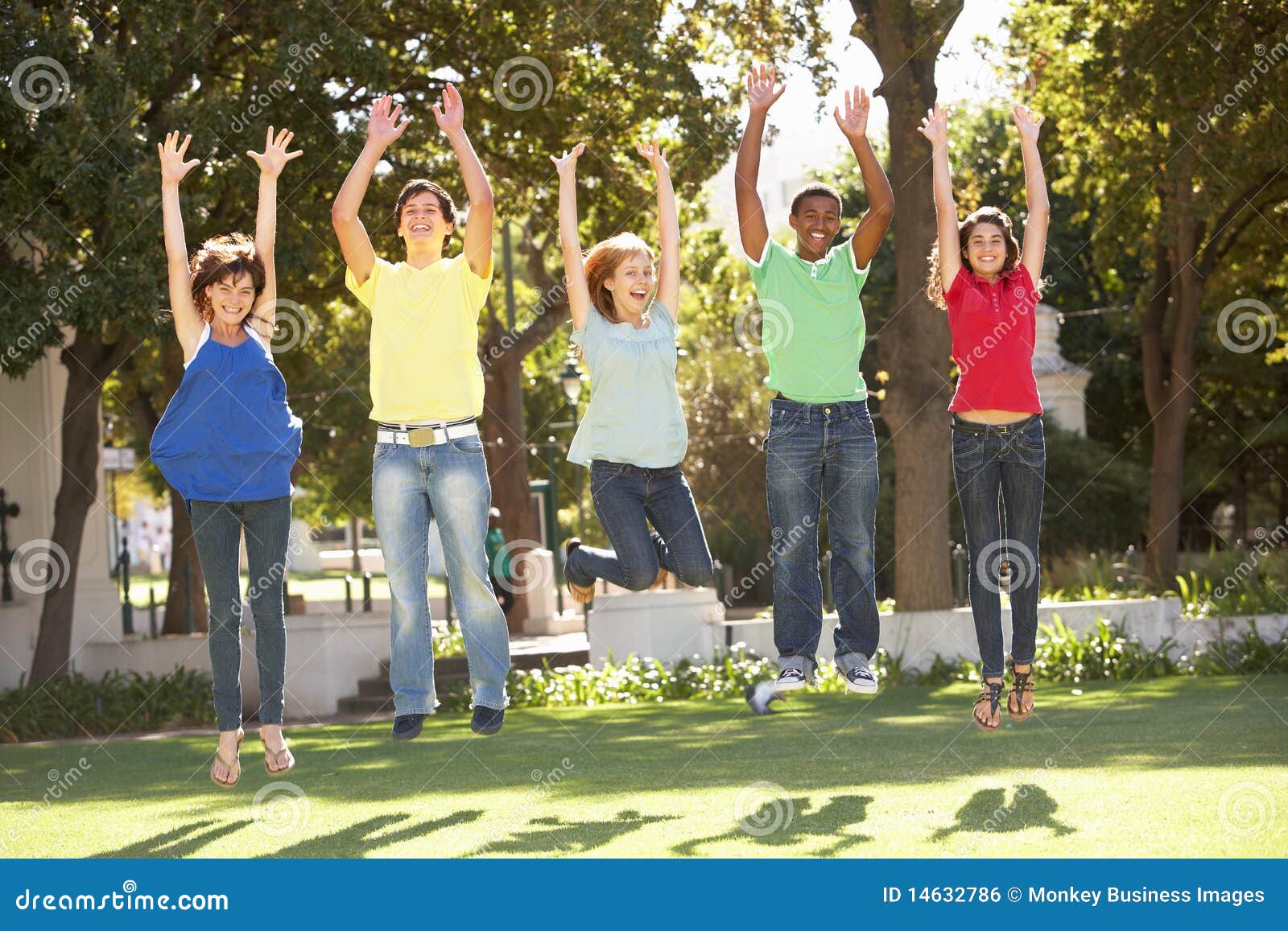 Teenagers Jumping in Air in Park Stock Photo - Image of outside ...