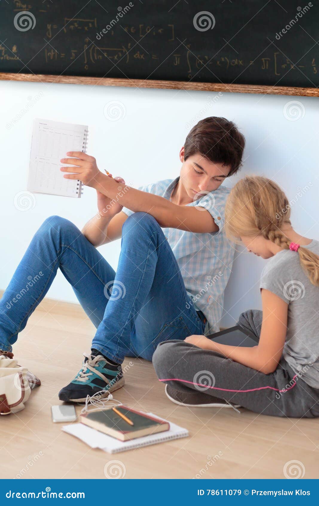 Teenagers Learning by a Blackboard in Classroom Stock Image - Image of ...