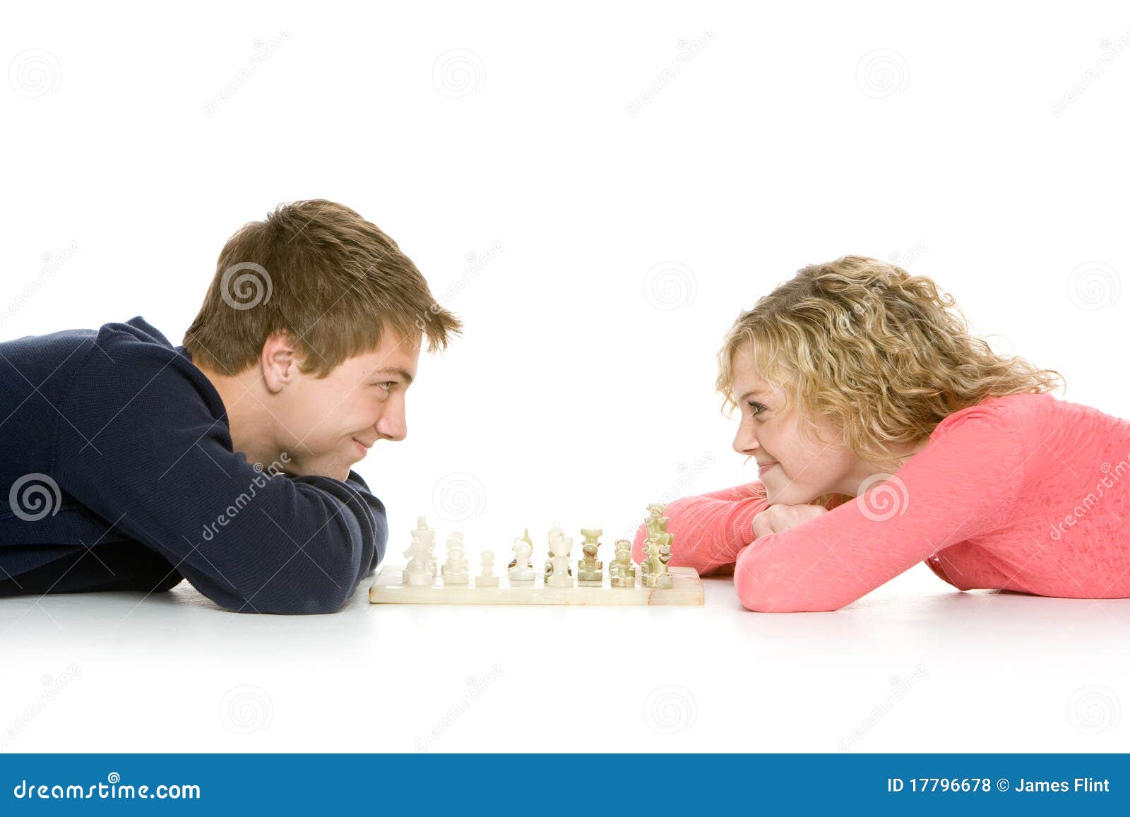 Teenagers Lying Down Playing Chess Stock Photo - Image of group, casual ...